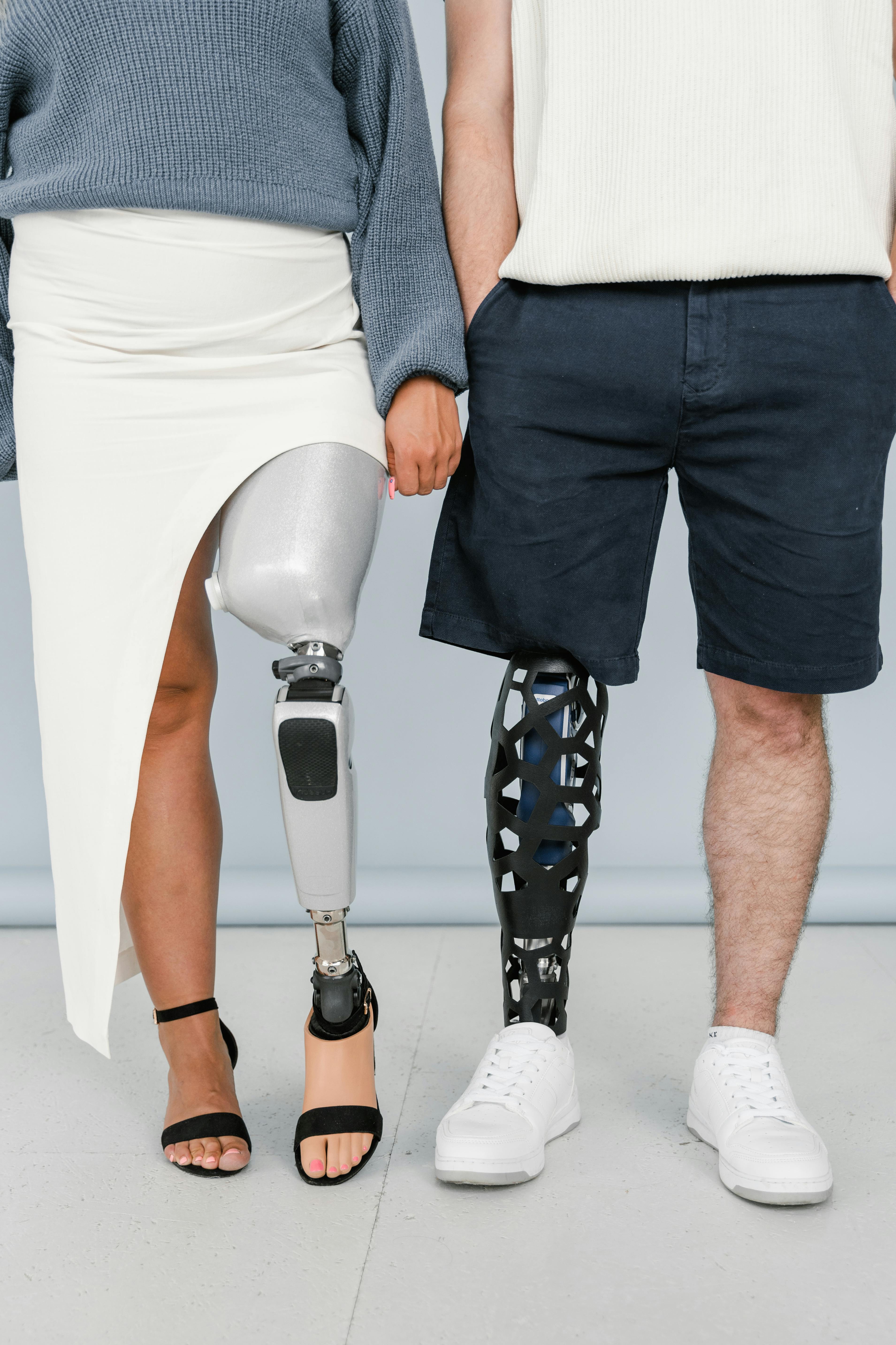 A Man and a Woman with Prosthetic Legs Standing Together · Free Stock Photo