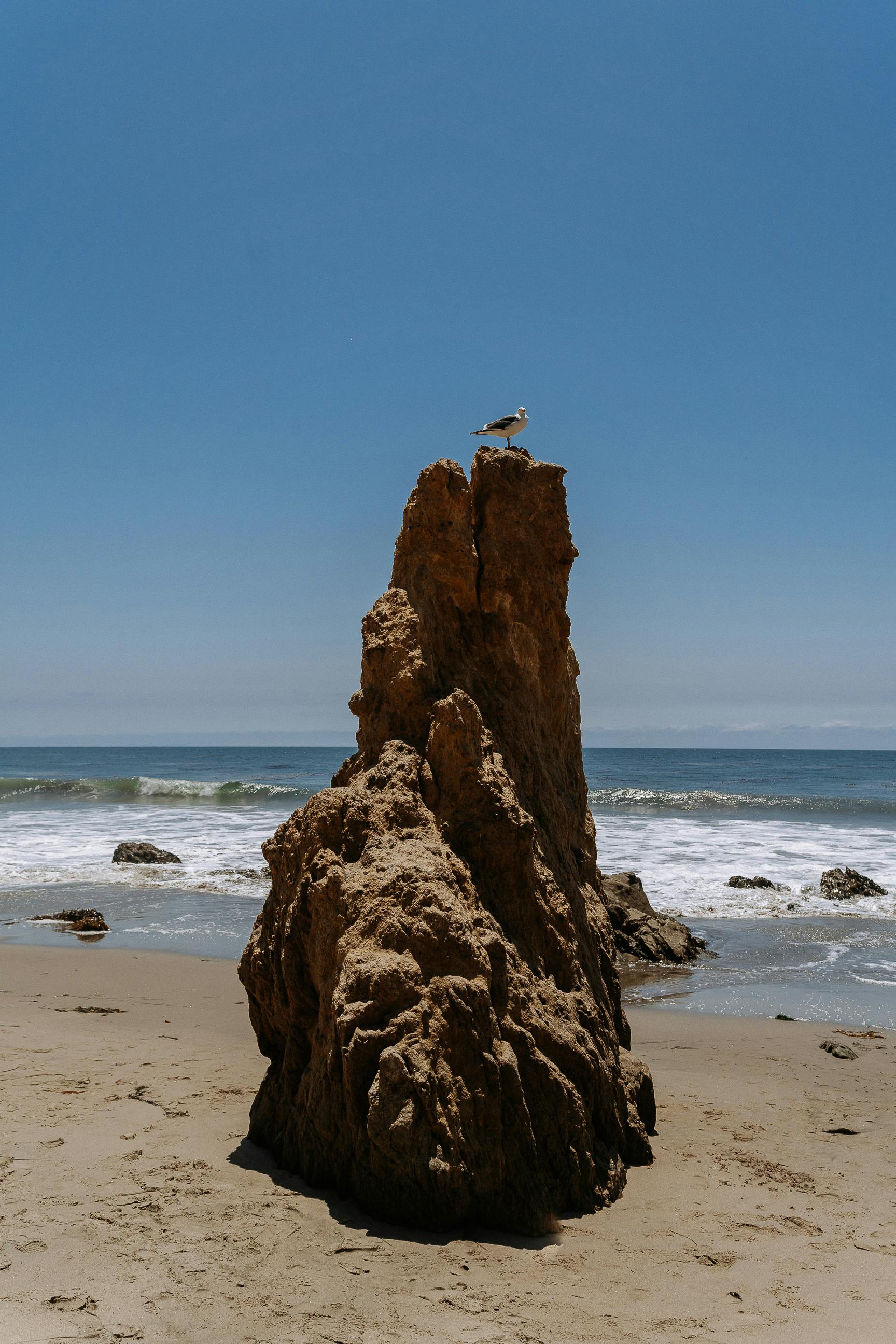 Rocks Forming Arch on Beach · Free Stock Photo