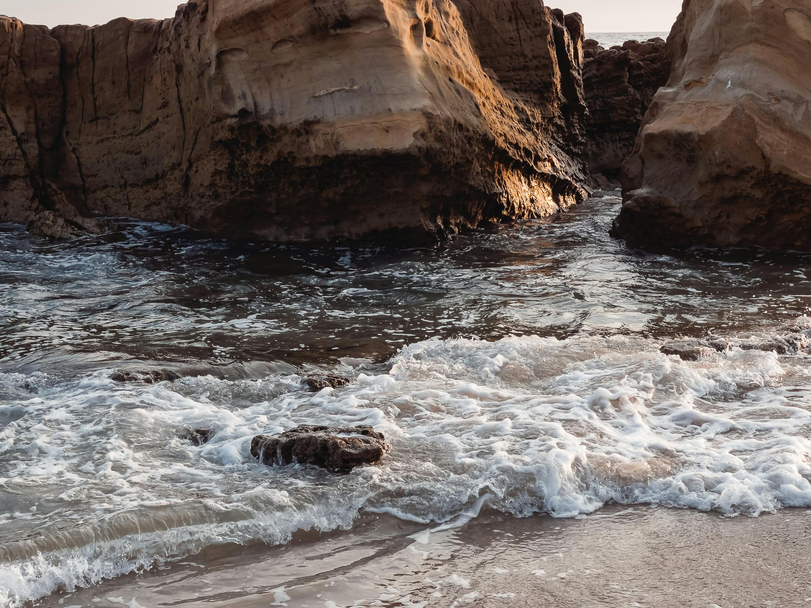 Woman in Bikini Lying on Rock on Beach · Free Stock Photo