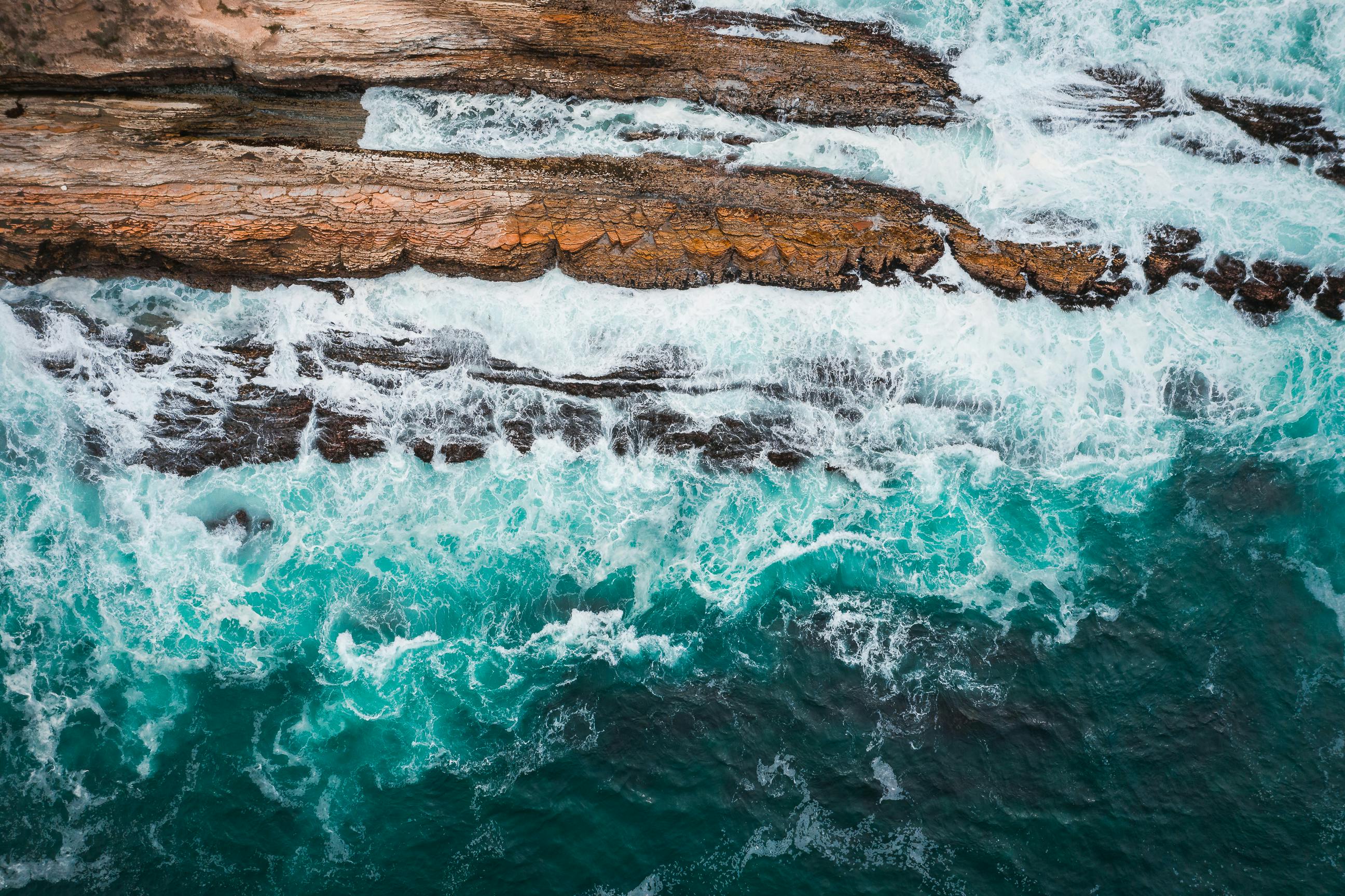 Aerial Photography of Rock Formation on the Ocean · Free Stock Photo