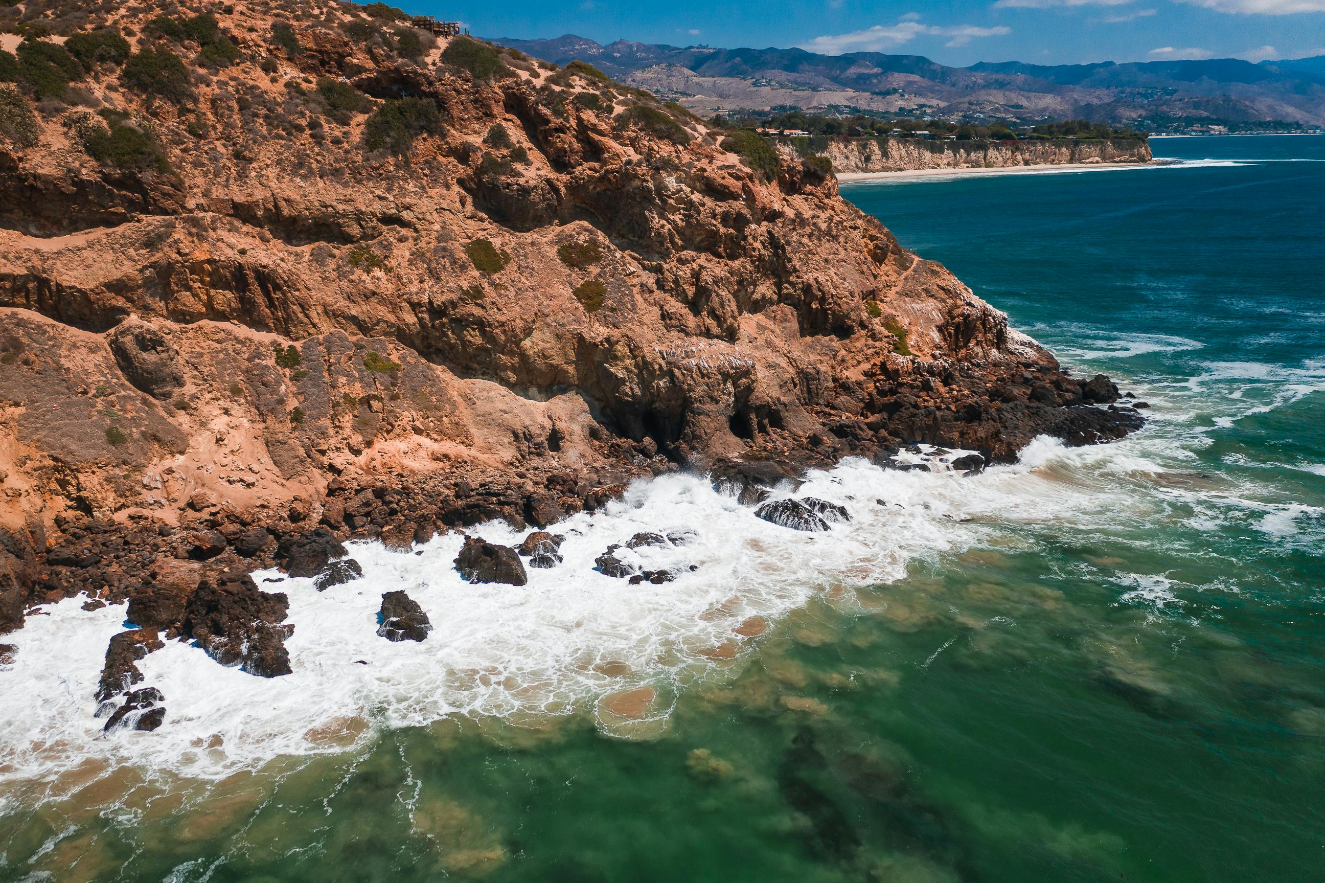 Waves Breaking on Rocky Cliffs on the Shore · Free Stock Photo