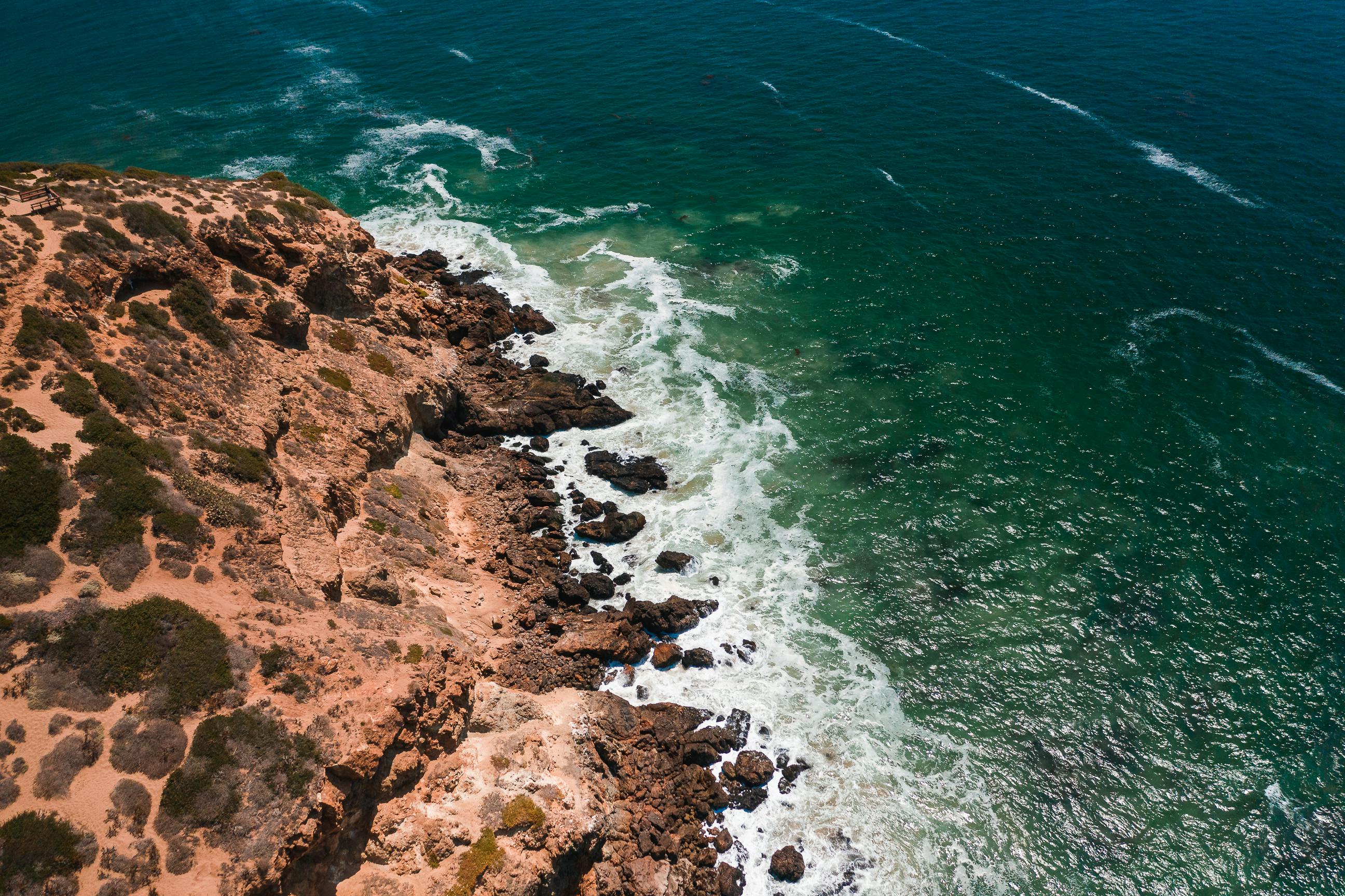 Top View Photo of Rocks by the Sea · Free Stock Photo