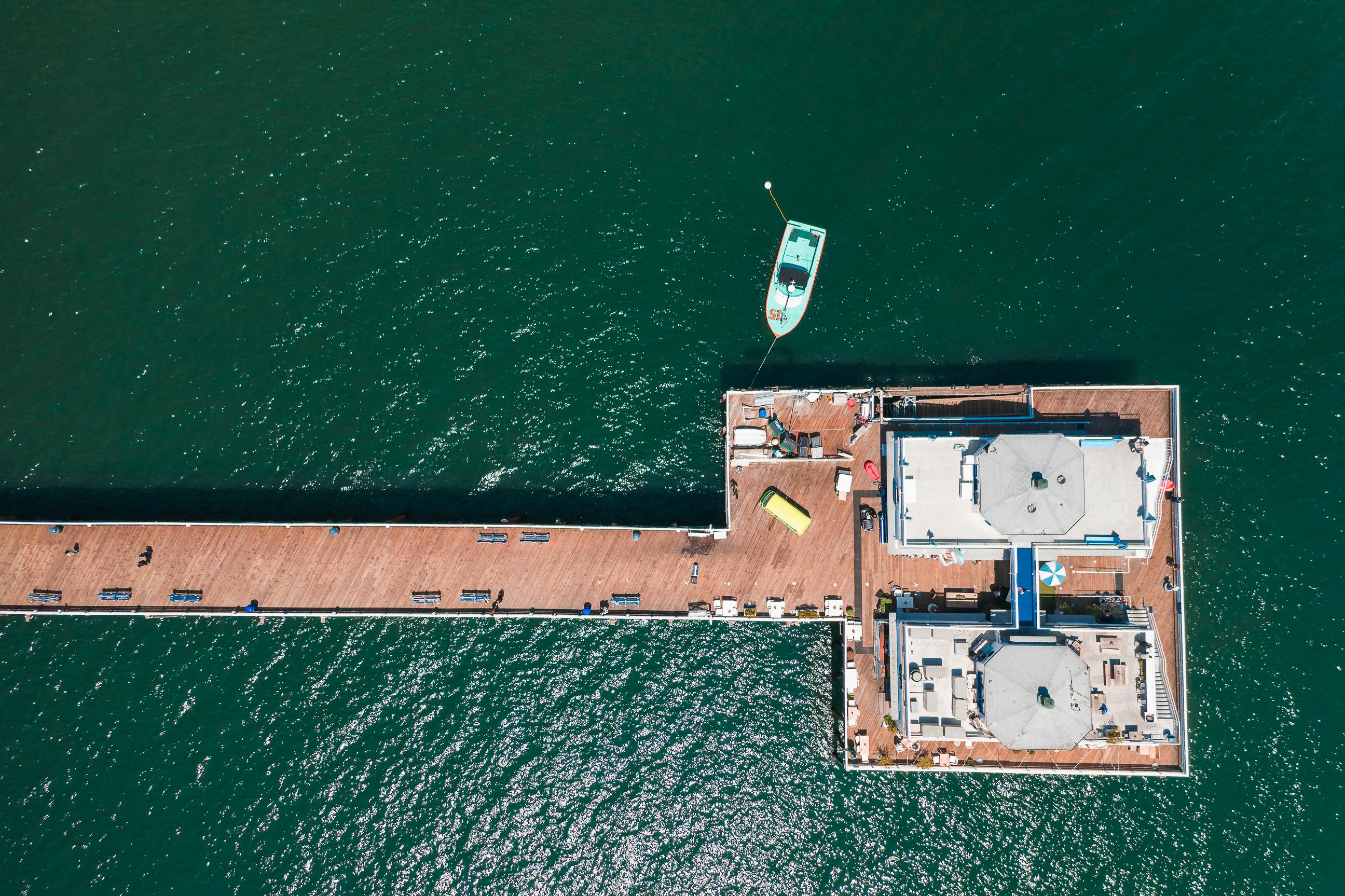 Aerial View of Boat near Brown Wooden Dock · Free Stock Photo