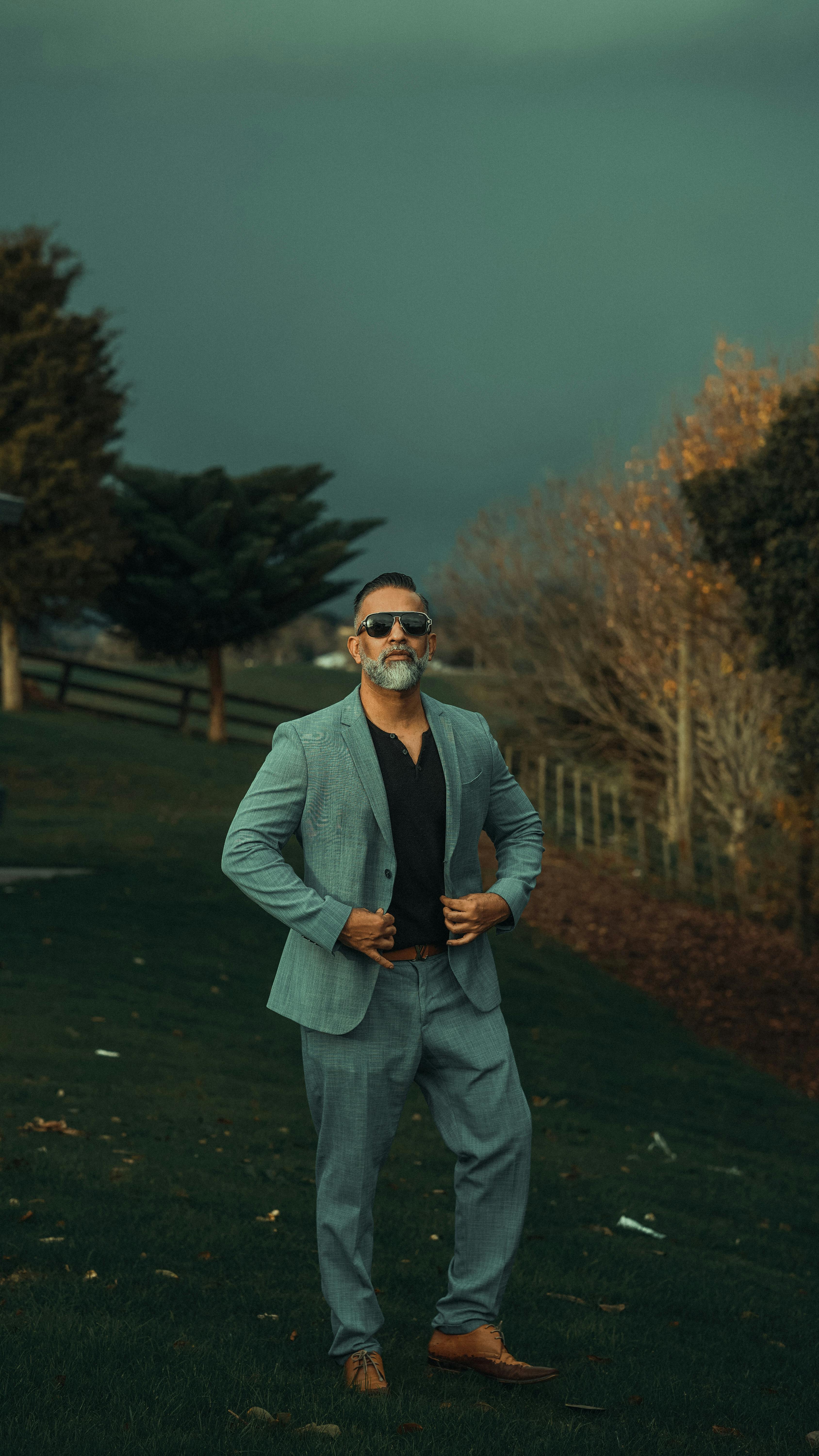 Gray Haired Man Stepping on a Yellow Fire Hydrant · Free Stock Photo