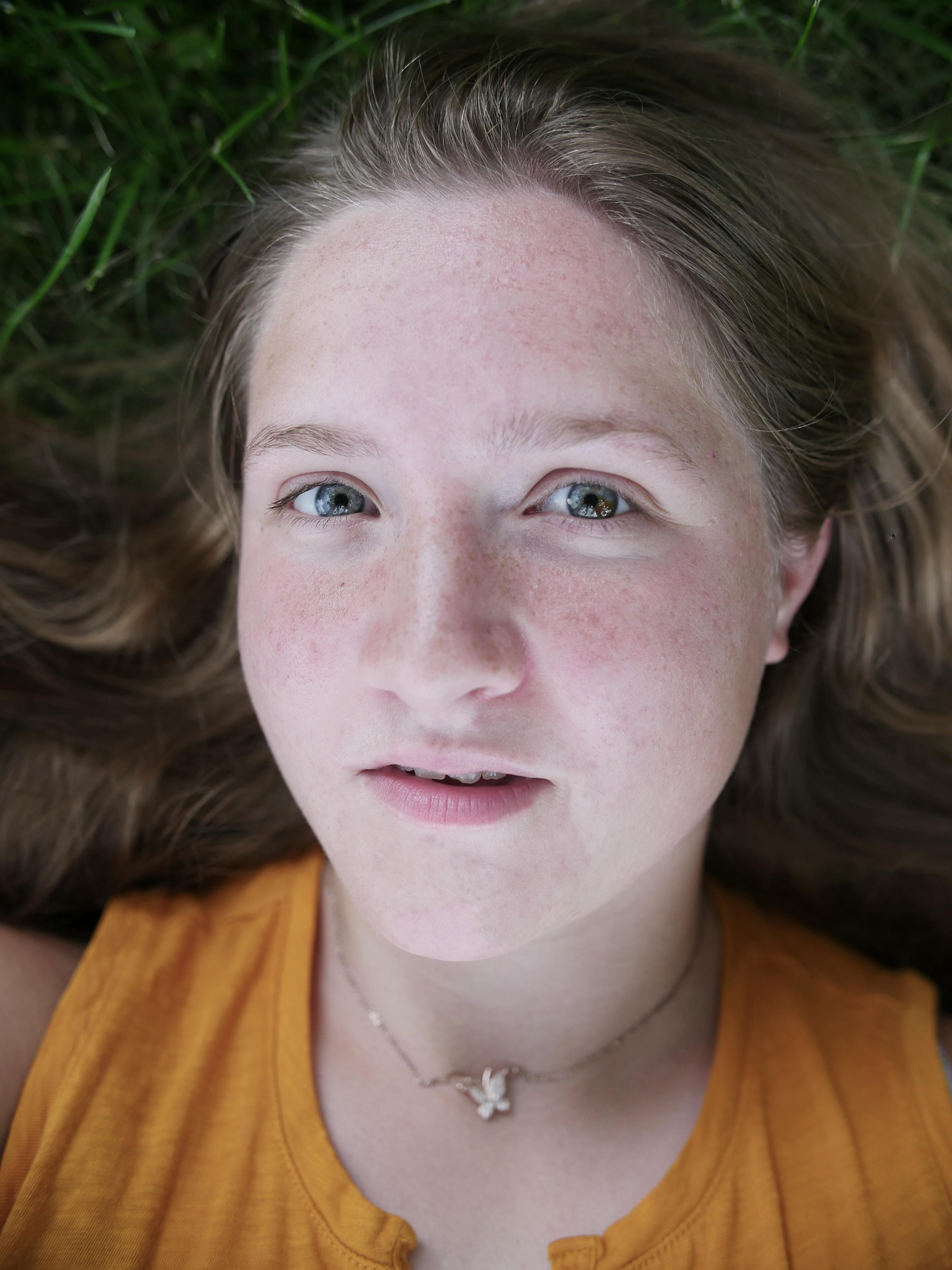 Overhead Shot of a Beautiful Girl Wearing a Necklace · Free Stock Photo