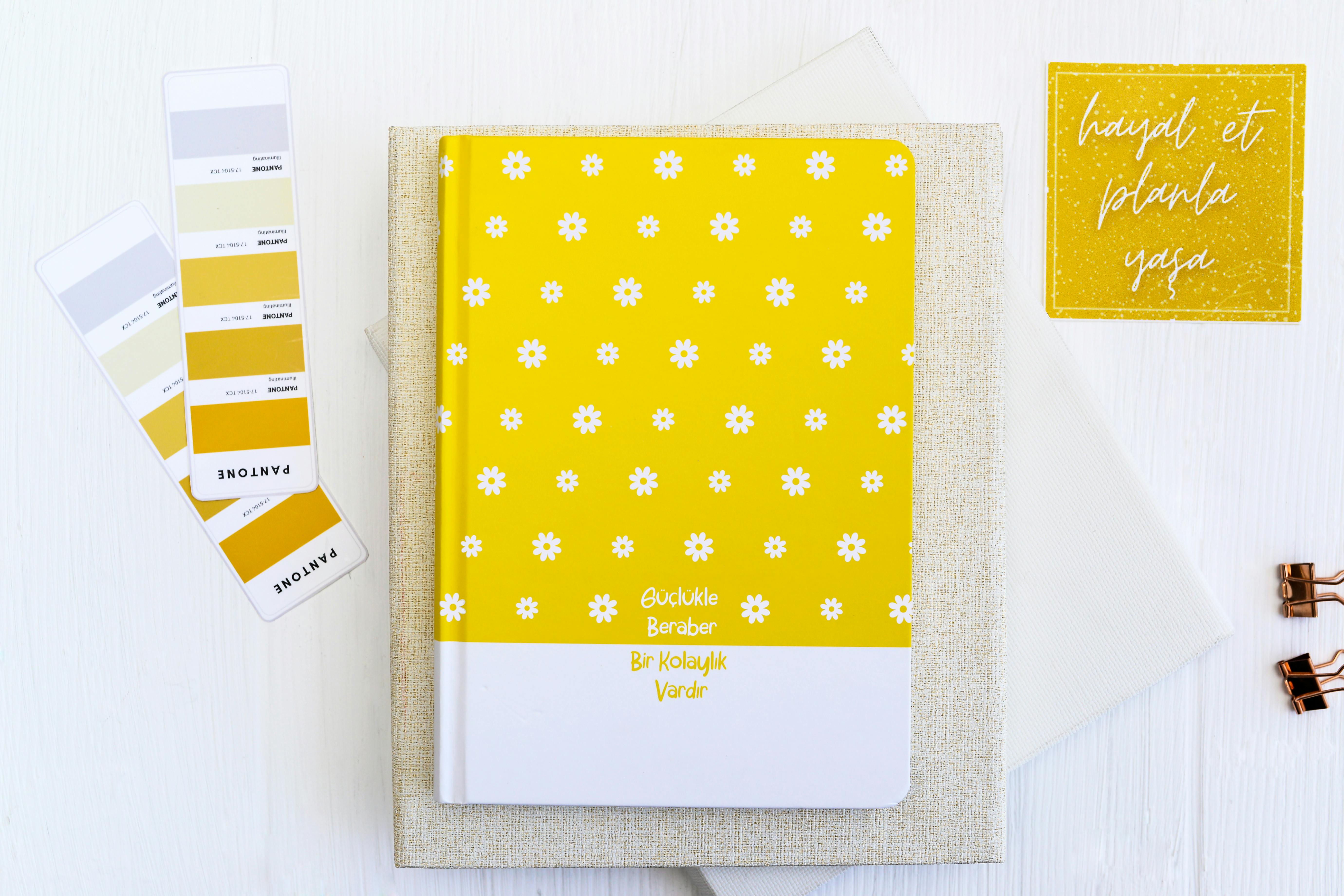 Yellow and White Floral Notebook · Free Stock Photo