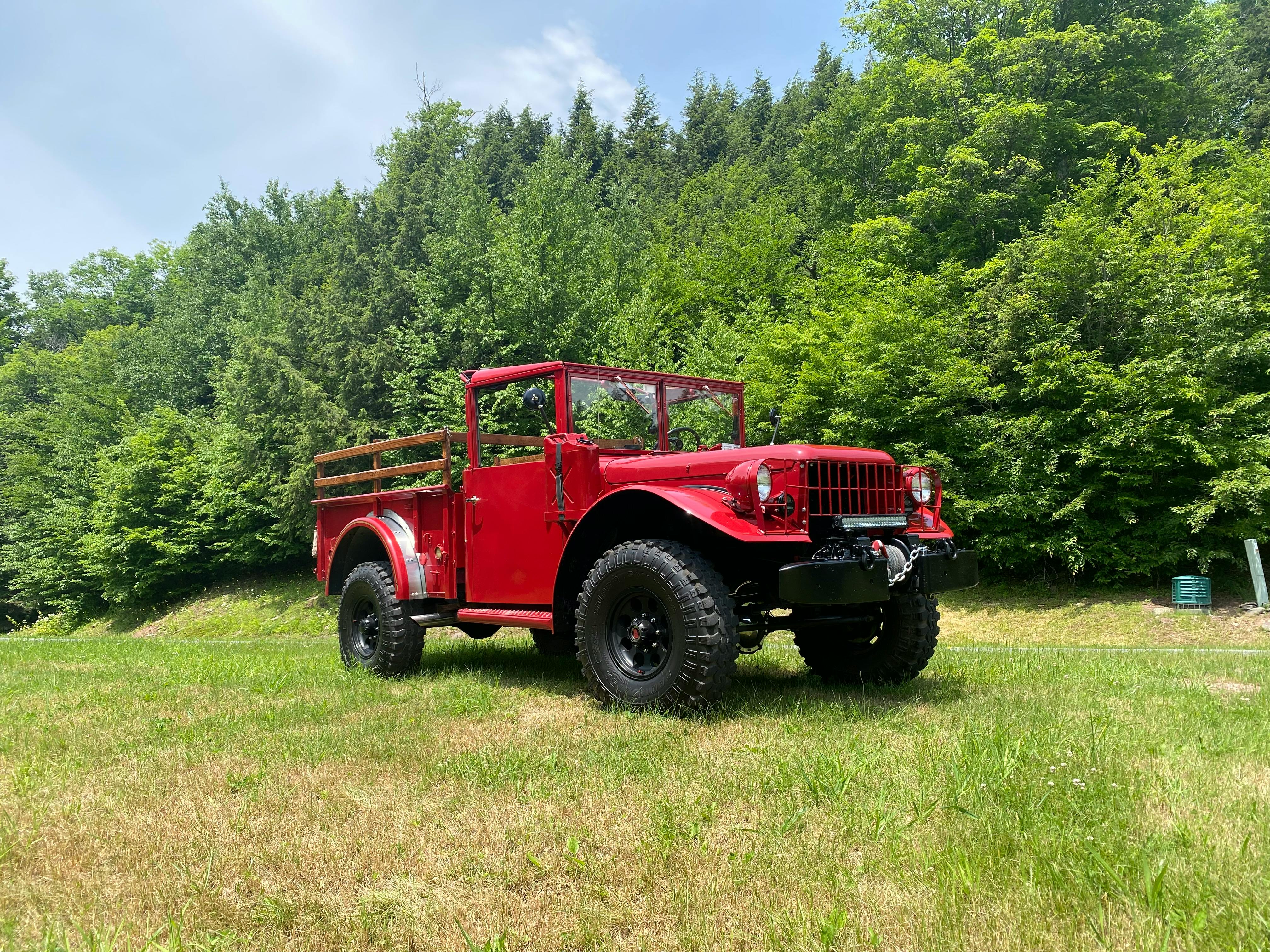 A Red Jeep on Green Grass Field · Free Stock Photo