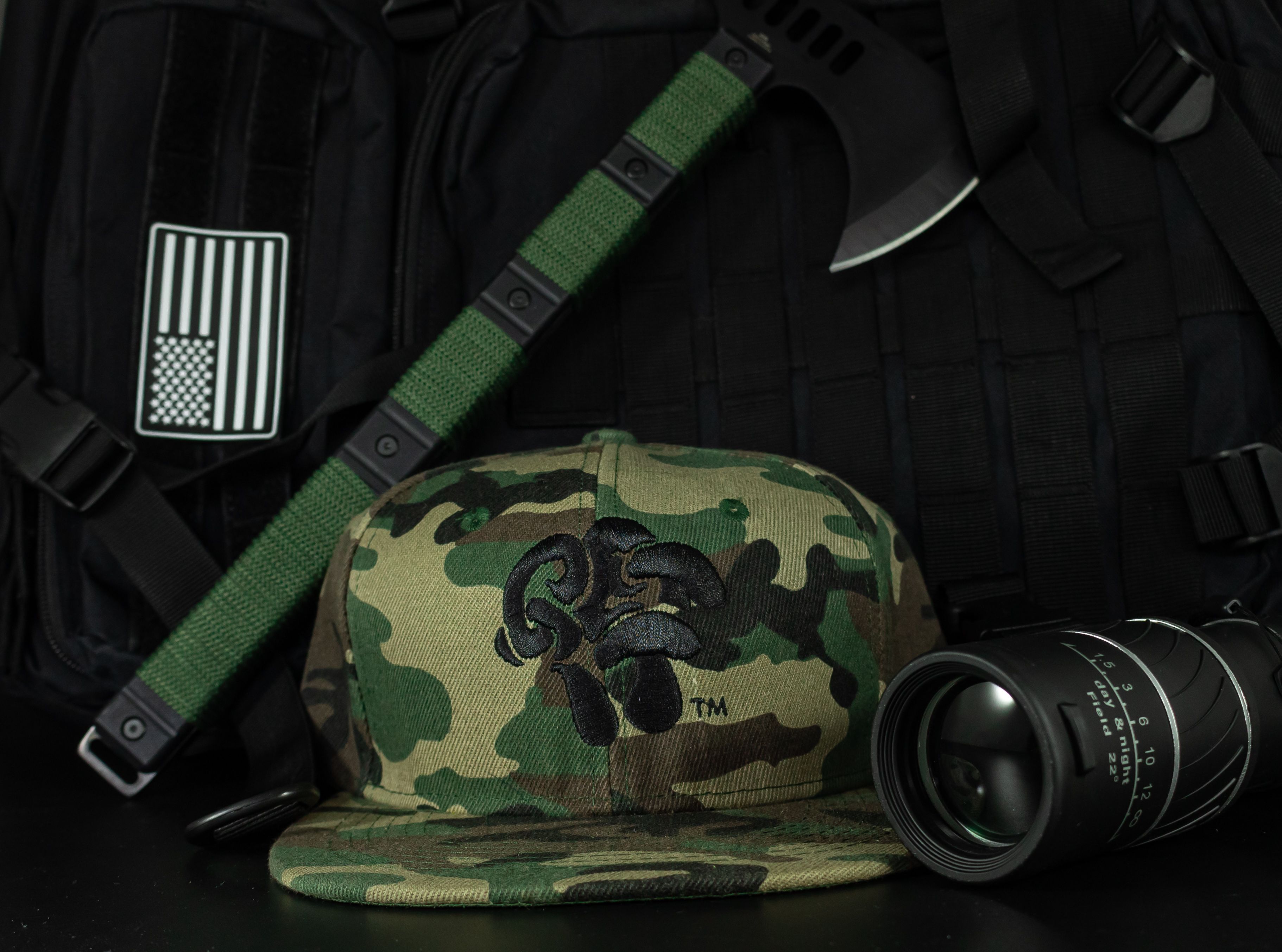 Black and Gray Camouflage Cap and Backpack · Free Stock Photo