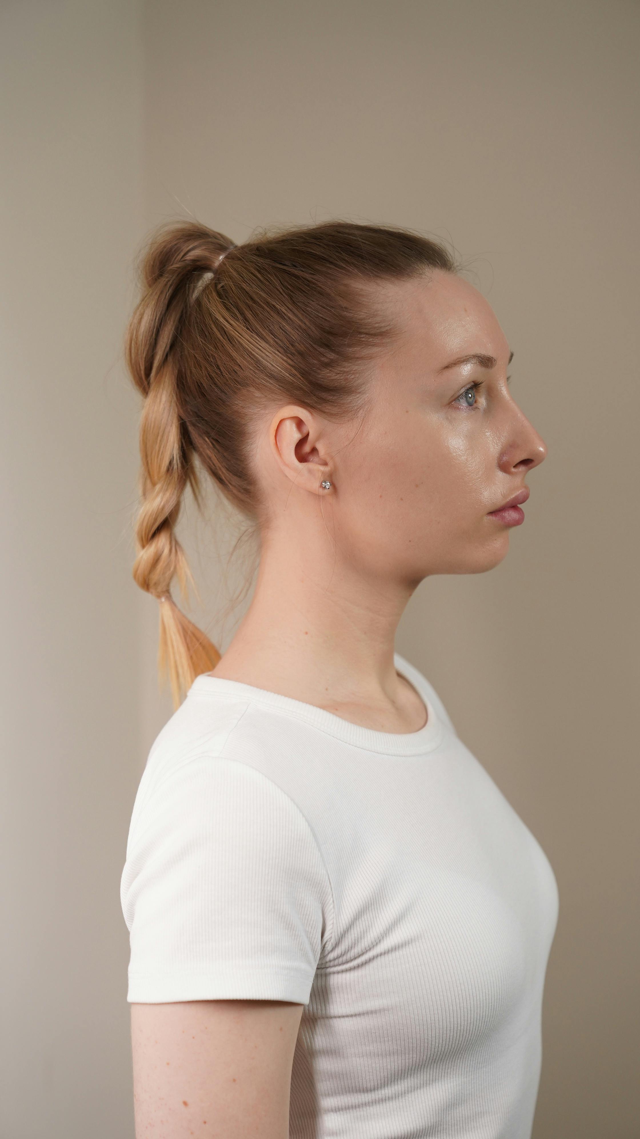 Woman Smiling with a Hand Twirling her Hair · Free Stock Photo