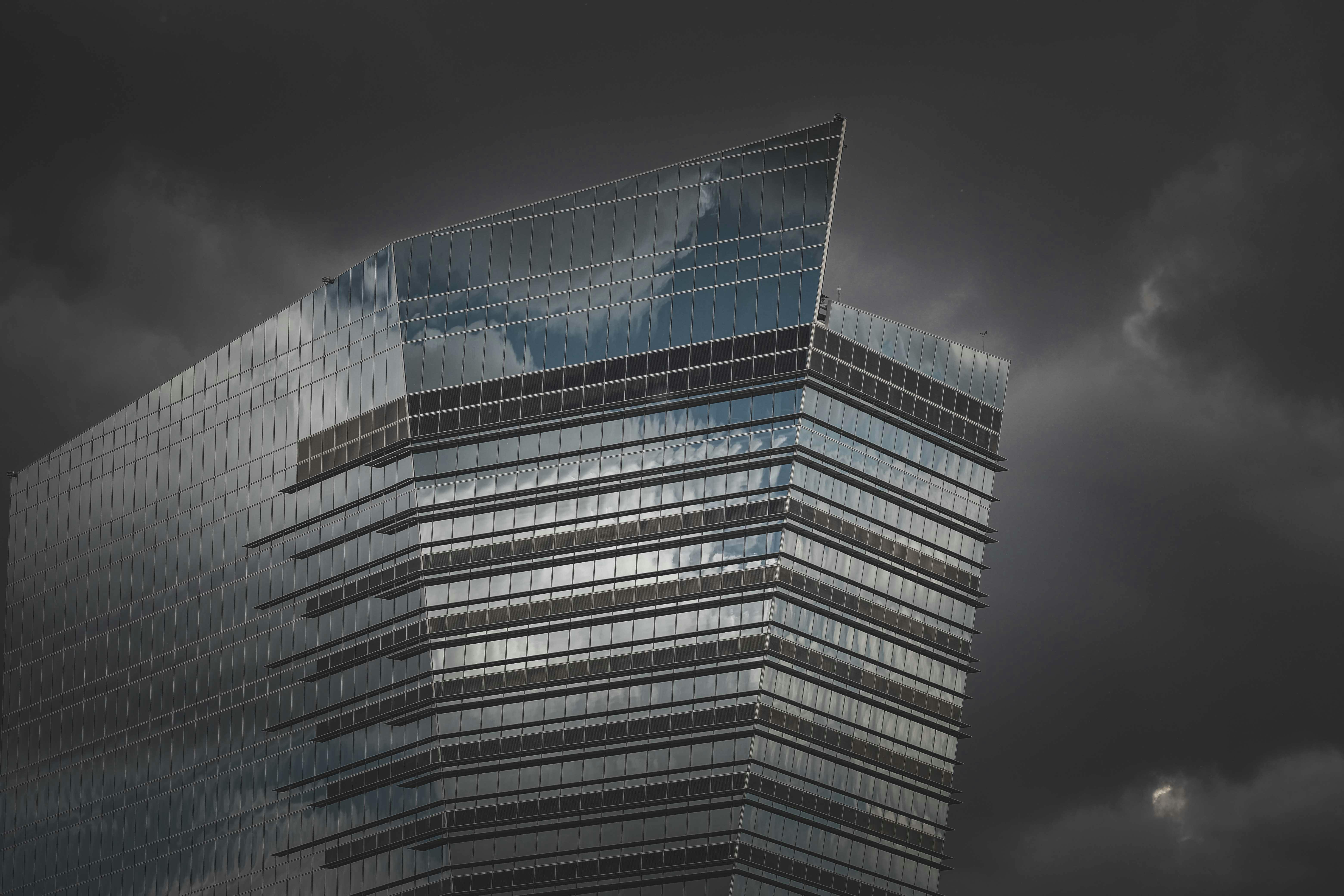 Storm Clouds Above Shiny Office Building · Free Stock Photo