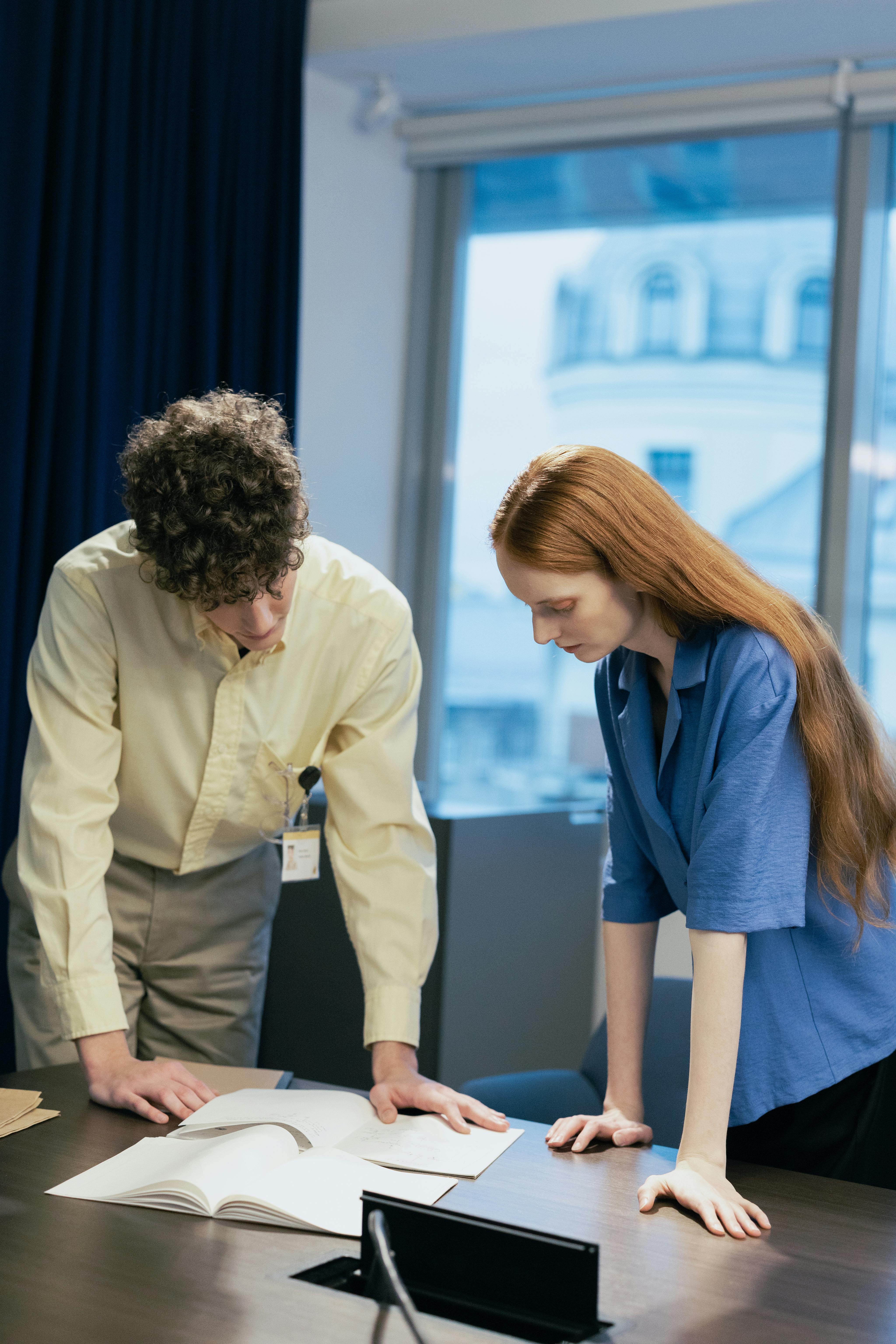 Coworkers Sharing Ideas At Work · Free Stock Photo
