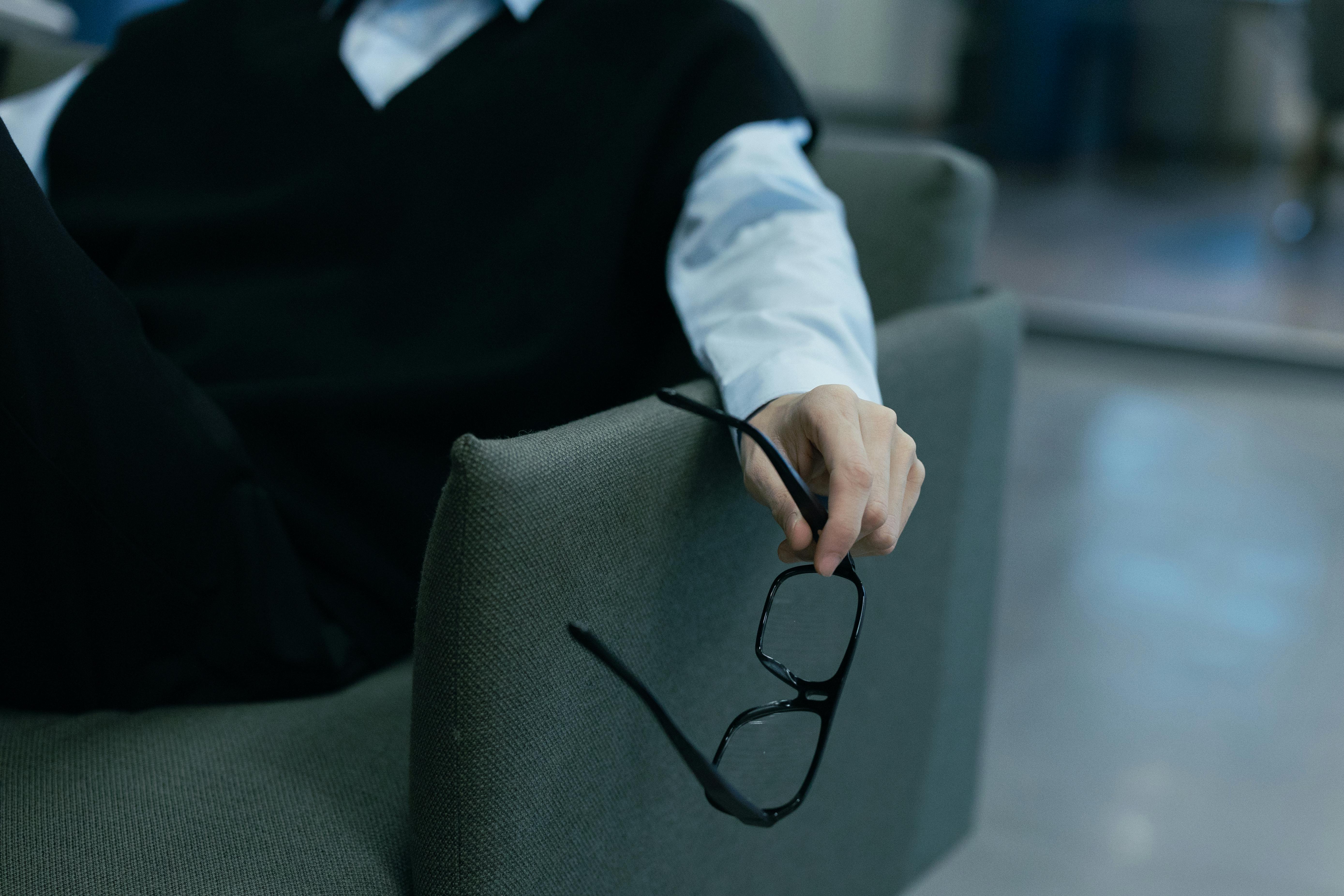 Person holding Black Framed Eyeglasses · Free Stock Photo