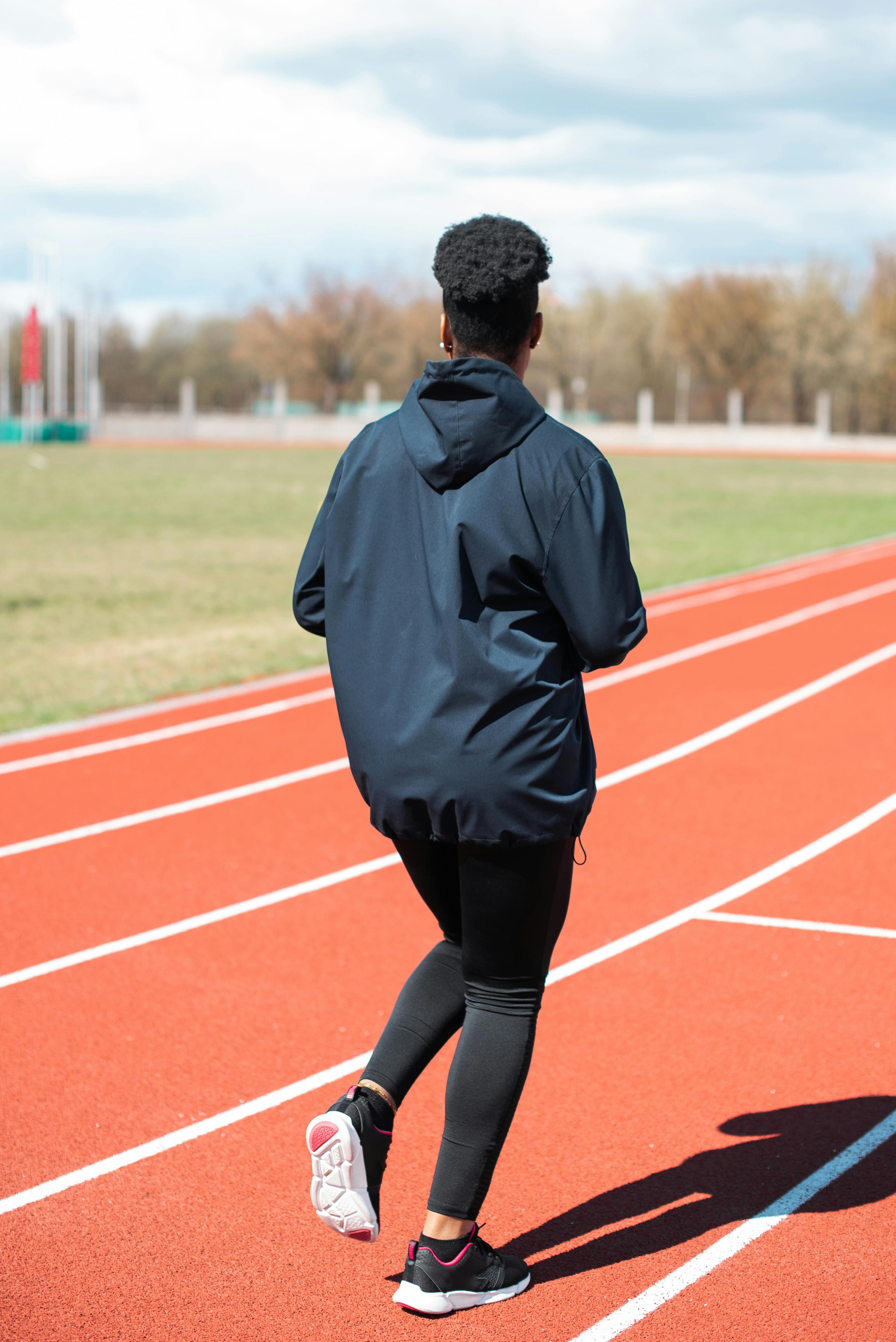 Woman Running on Track · Free Stock Photo