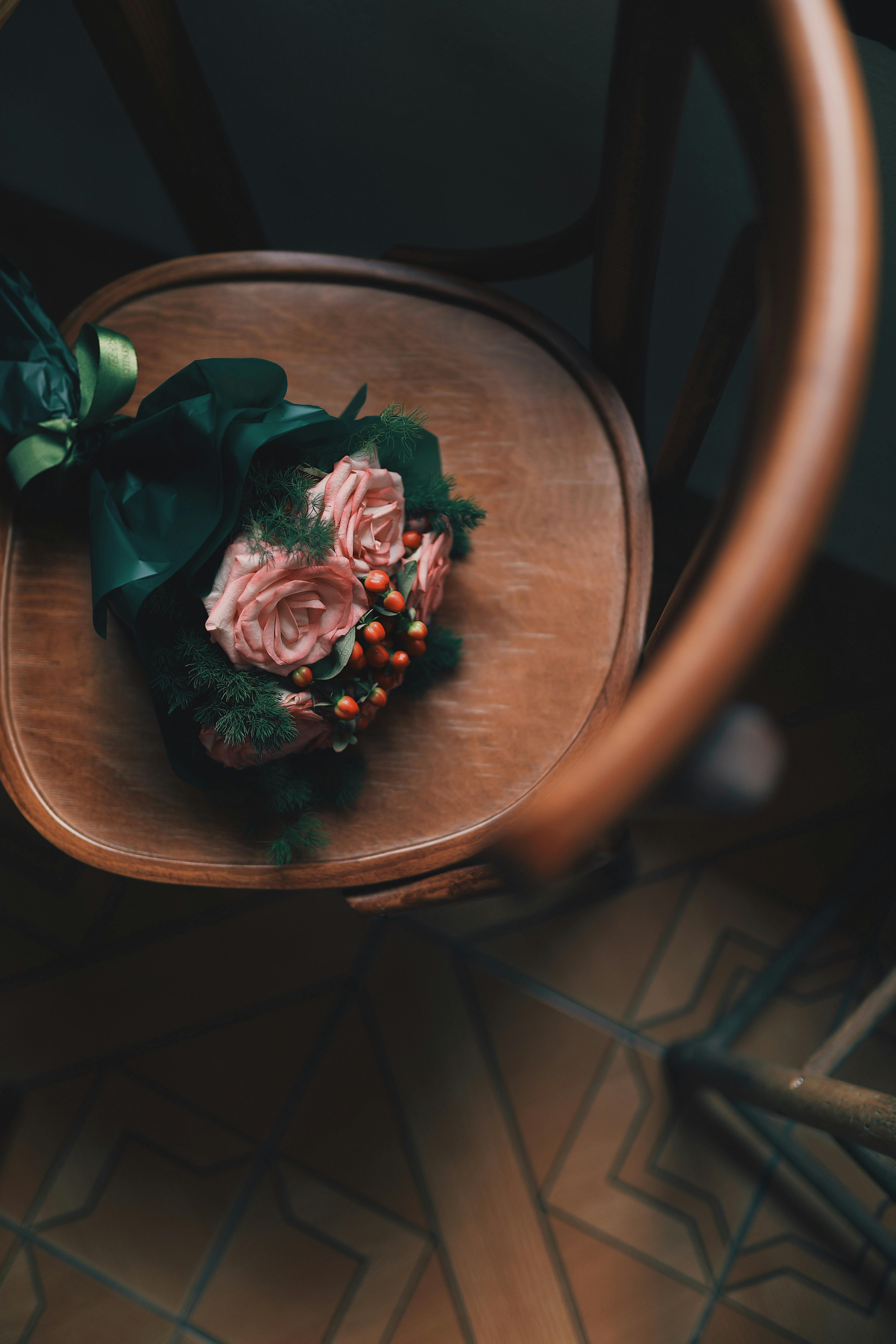 A Bouquet of Flowers on a Wooden Chair · Free Stock Photo
