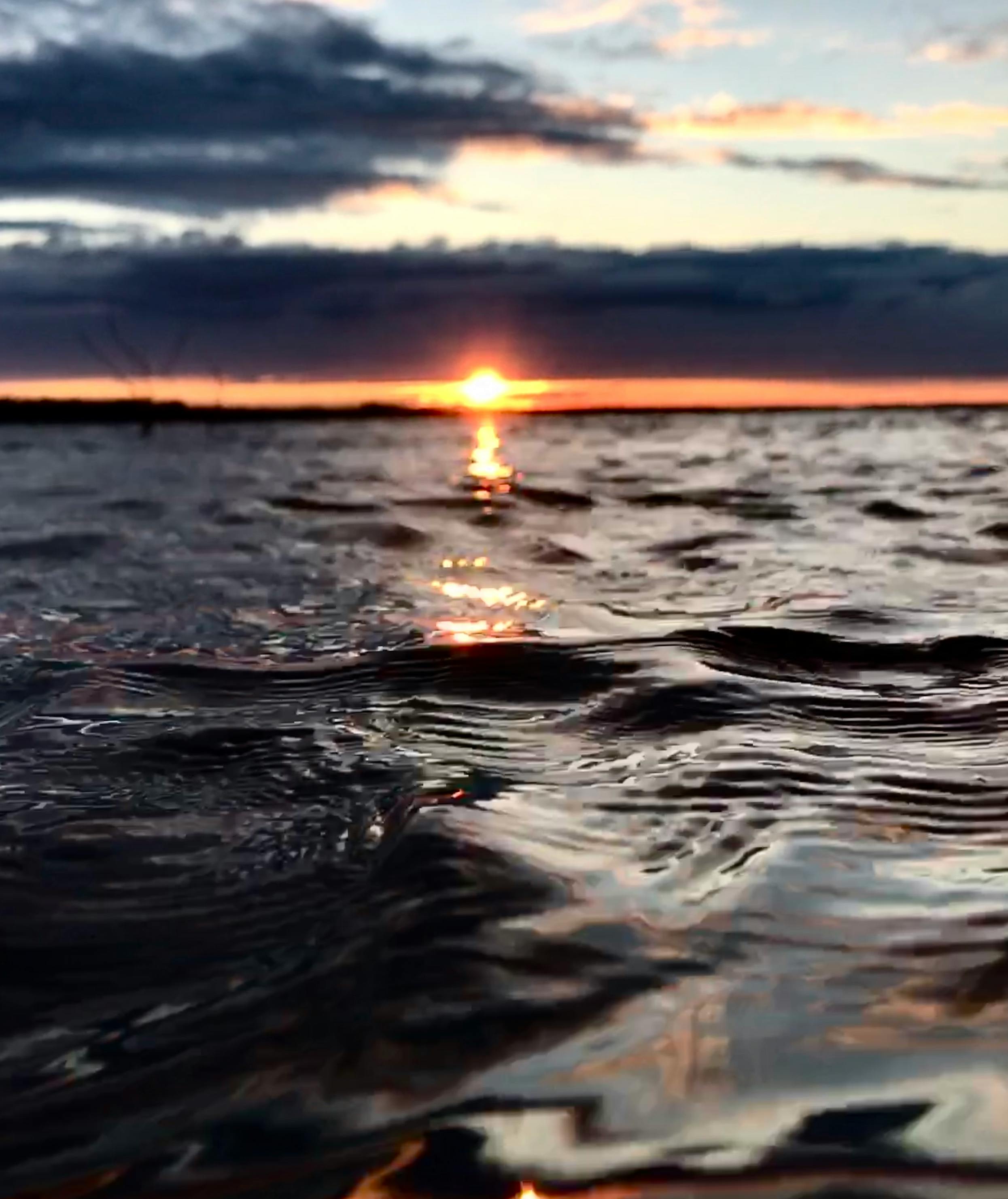 Sun Setting above Calm Sea · Free Stock Photo