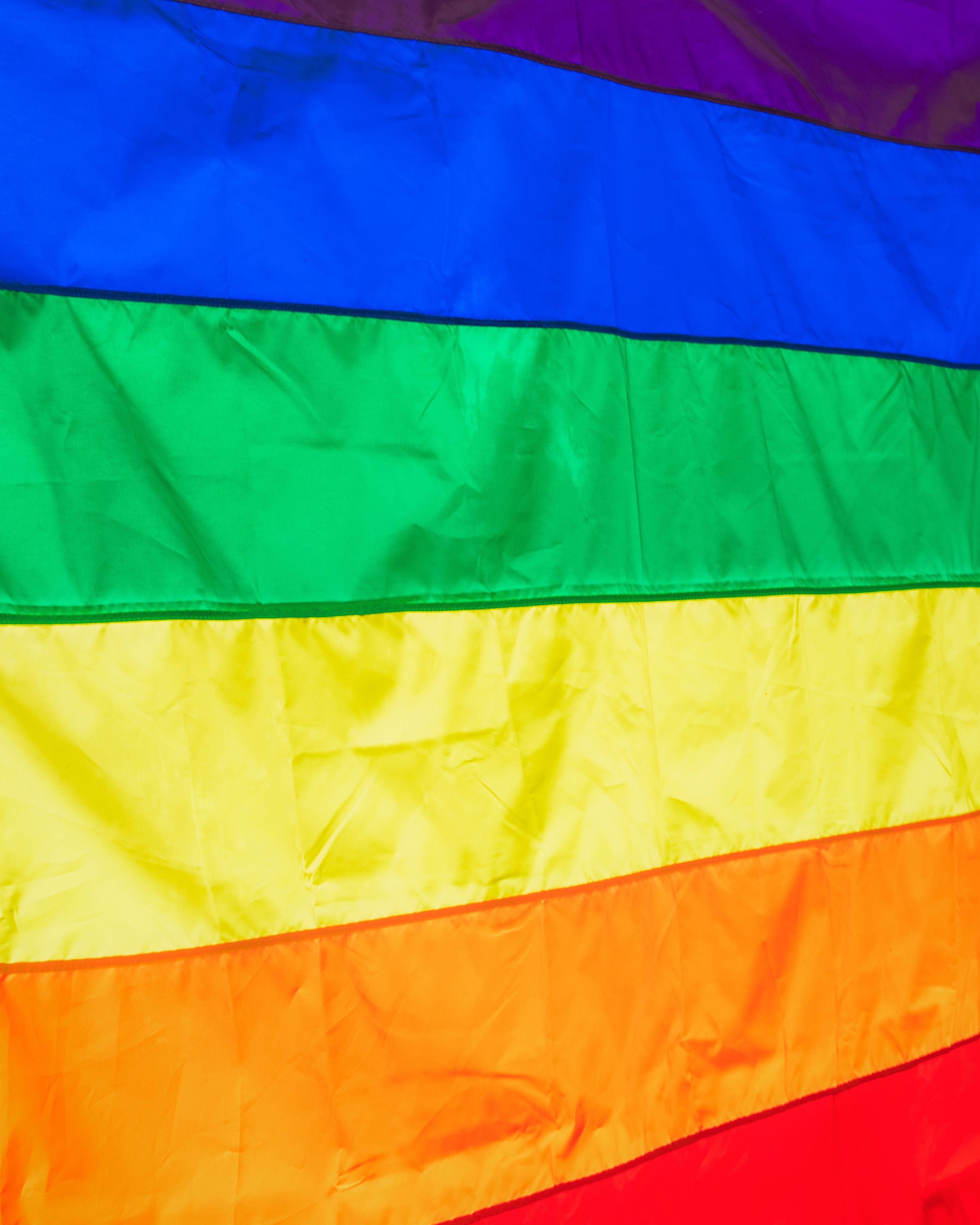 Close-Up Shot of a Rainbow Flag · Free Stock Photo