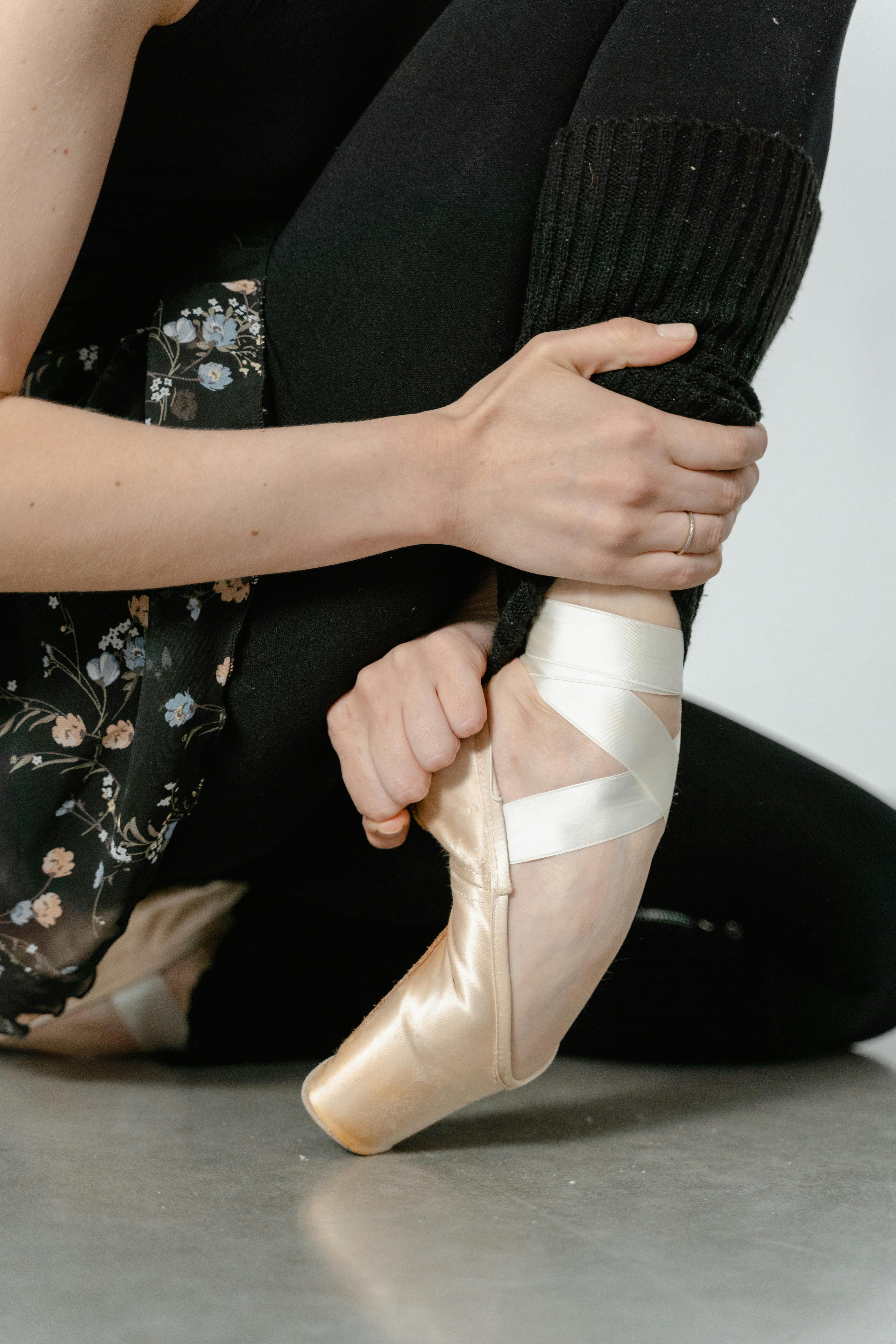 Woman Holding Her Leg and Foot · Free Stock Photo