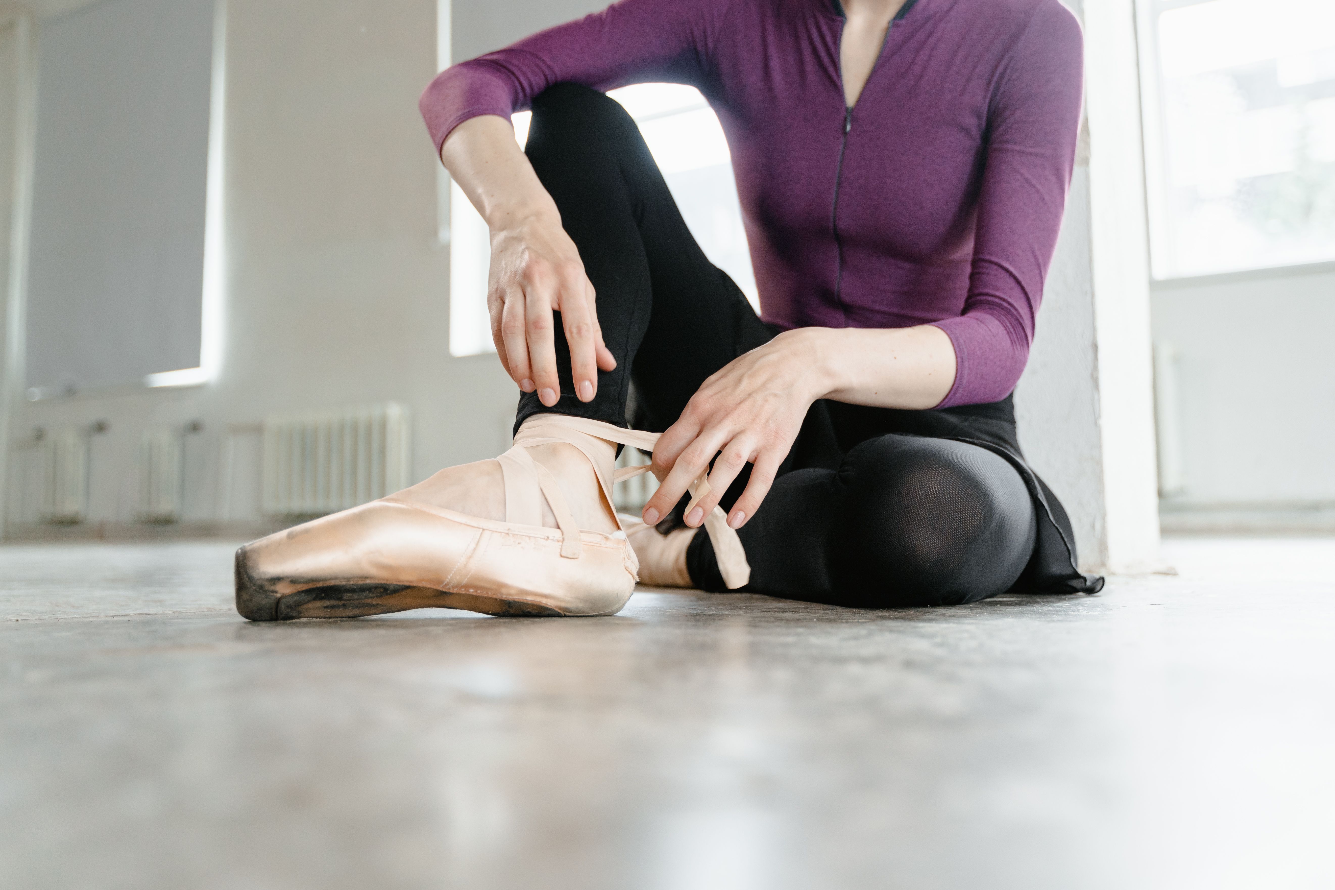 A Woman Wearing Ballet Shoes · Free Stock Photo