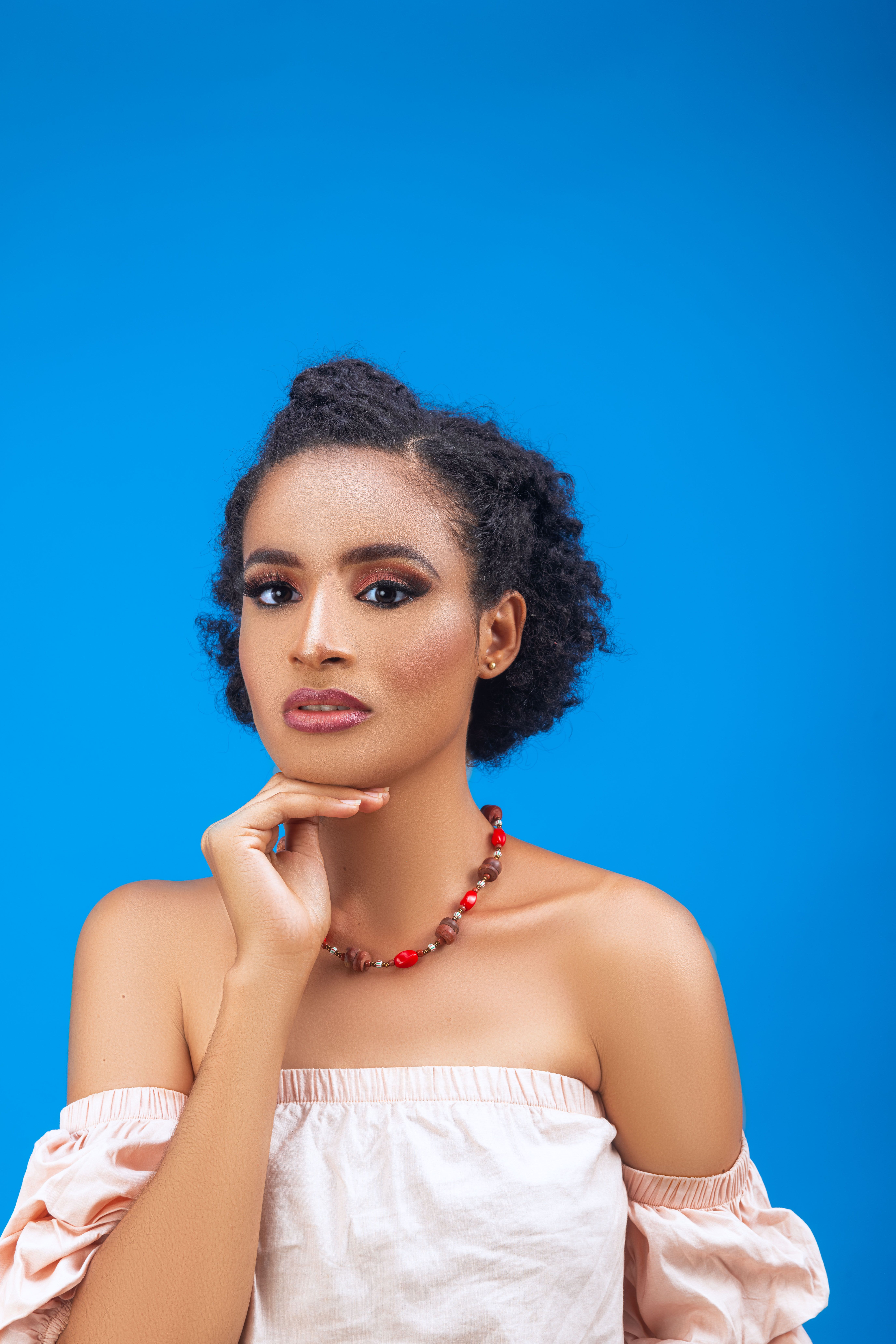 Portrait of Beautiful Woman on Blue Studio Background · Free Stock Photo