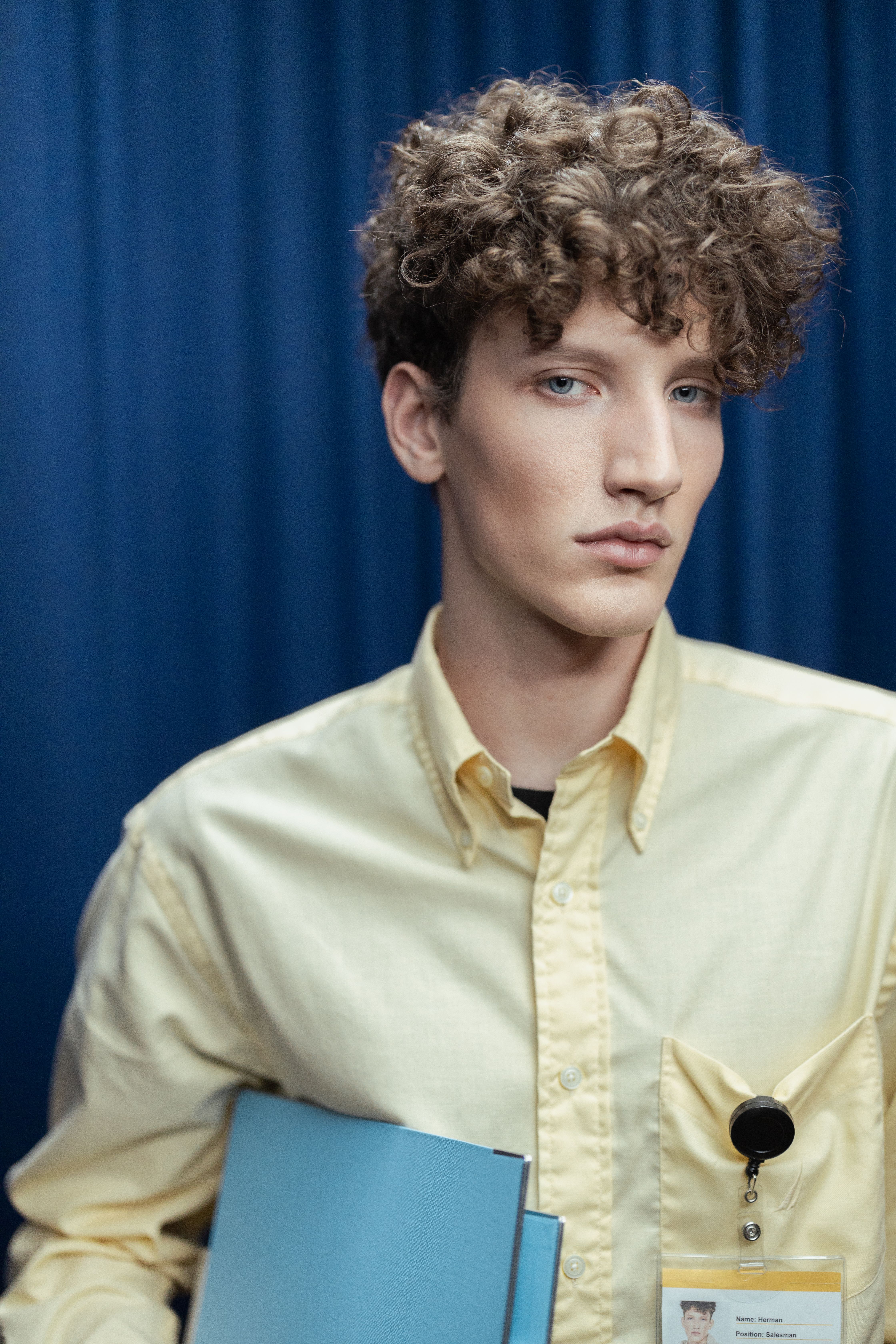 A Man in Yellow Long Sleeves Looking with a Serious Face · Free Stock Photo