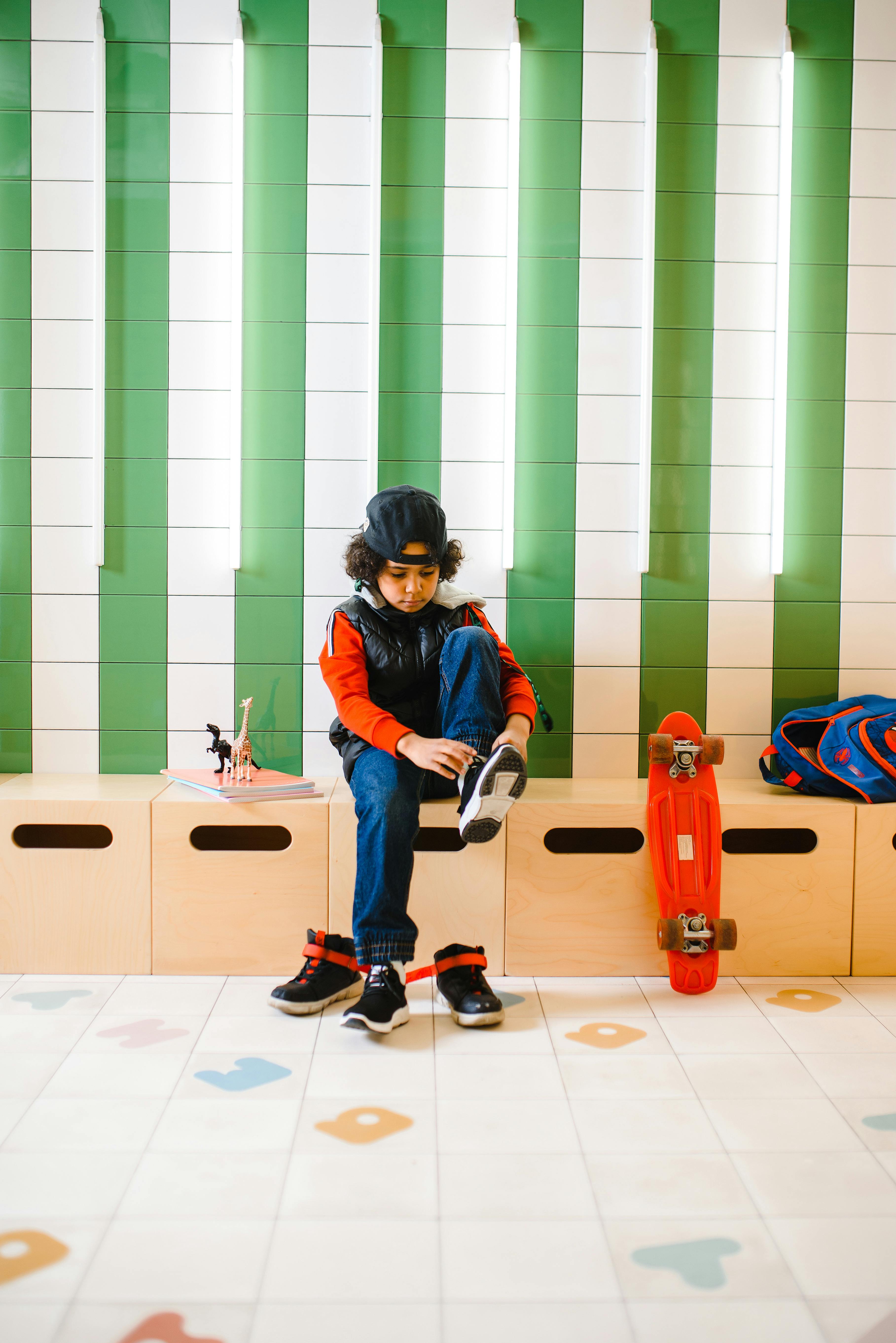 A Boy Wearing His Sneakers · Free Stock Photo