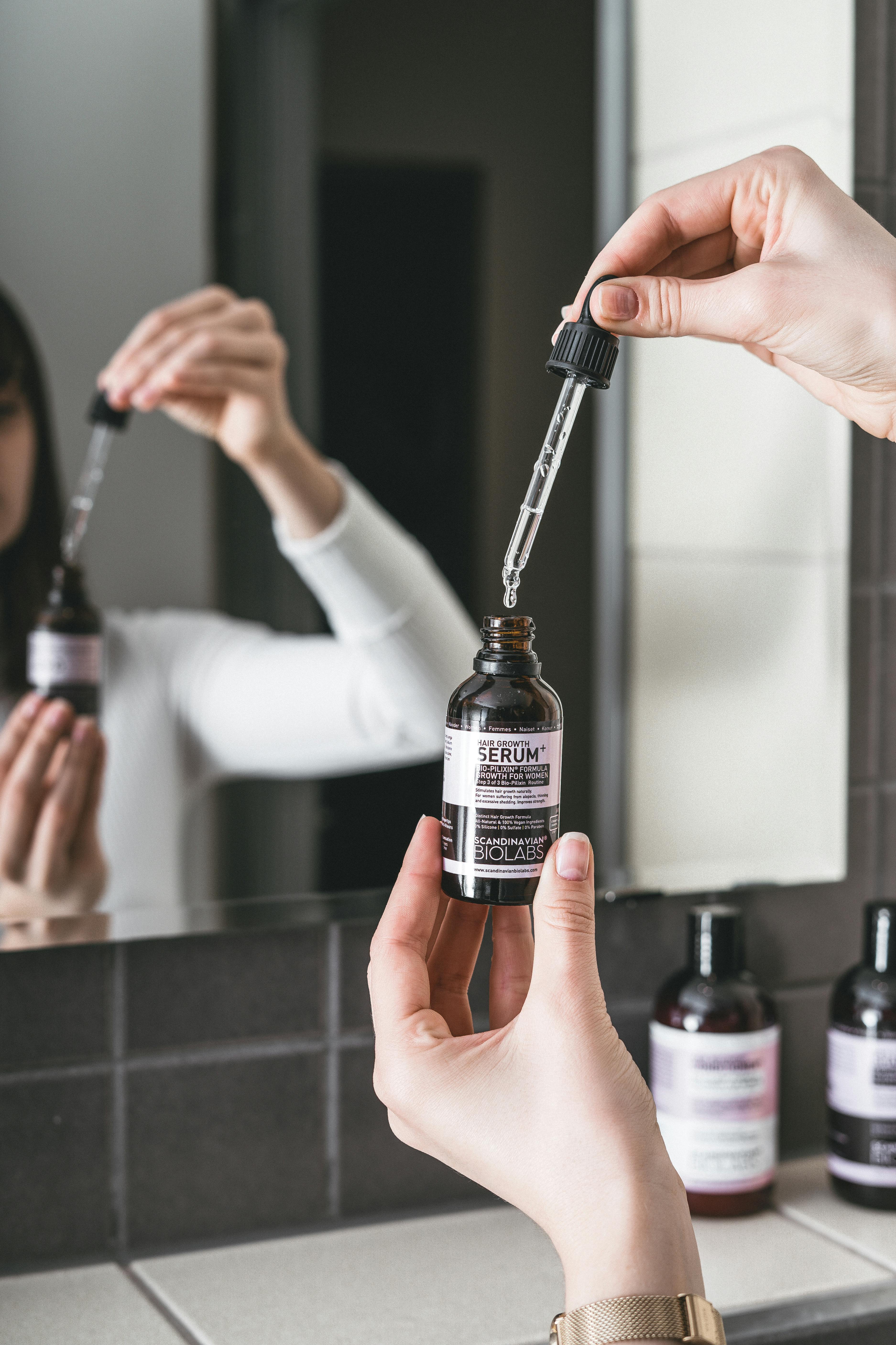 Droplets Dripping from Clear Dropper · Free Stock Photo