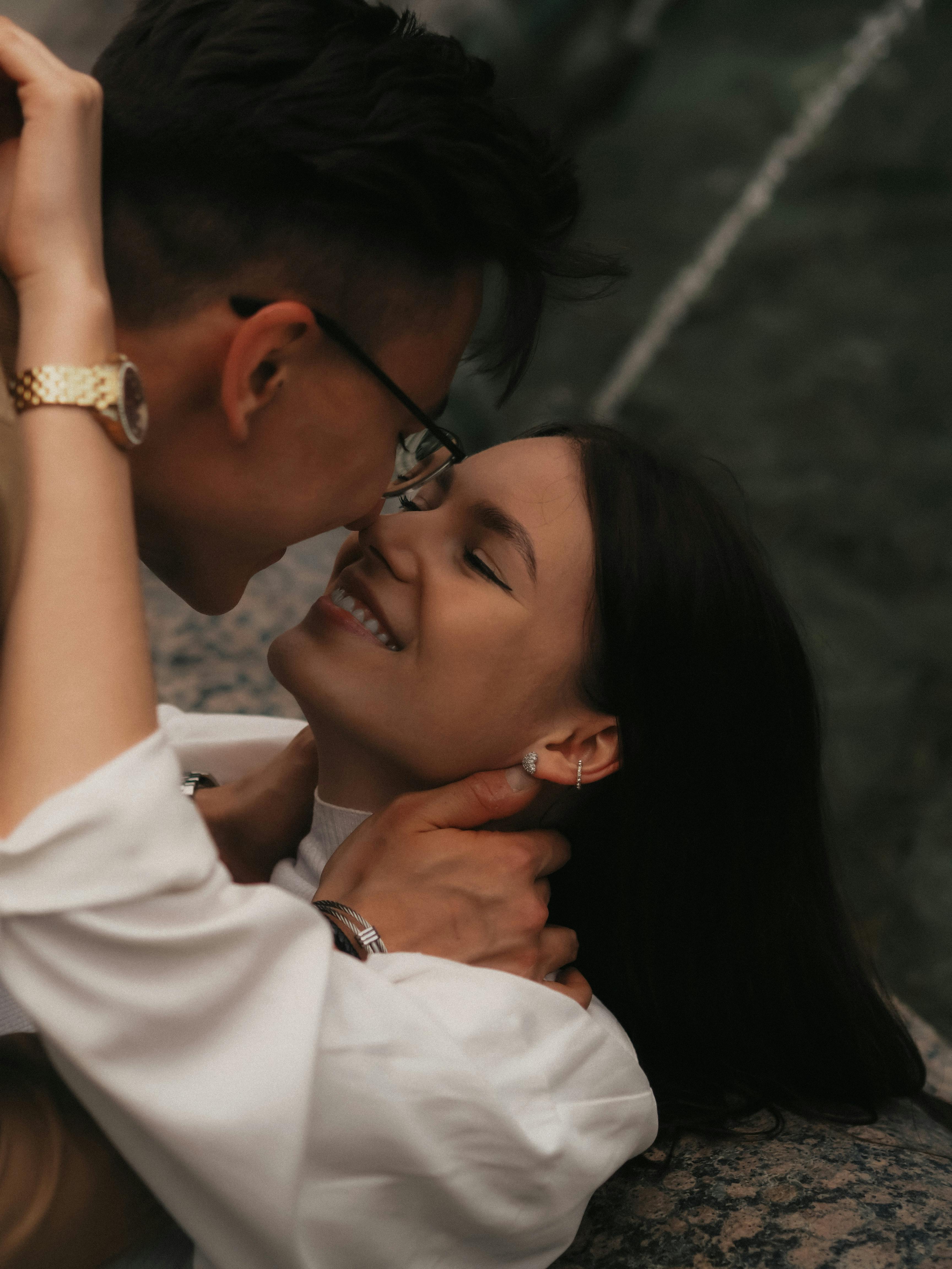 A Happy Couple Facing Each Other Touching Noses · Free Stock Photo