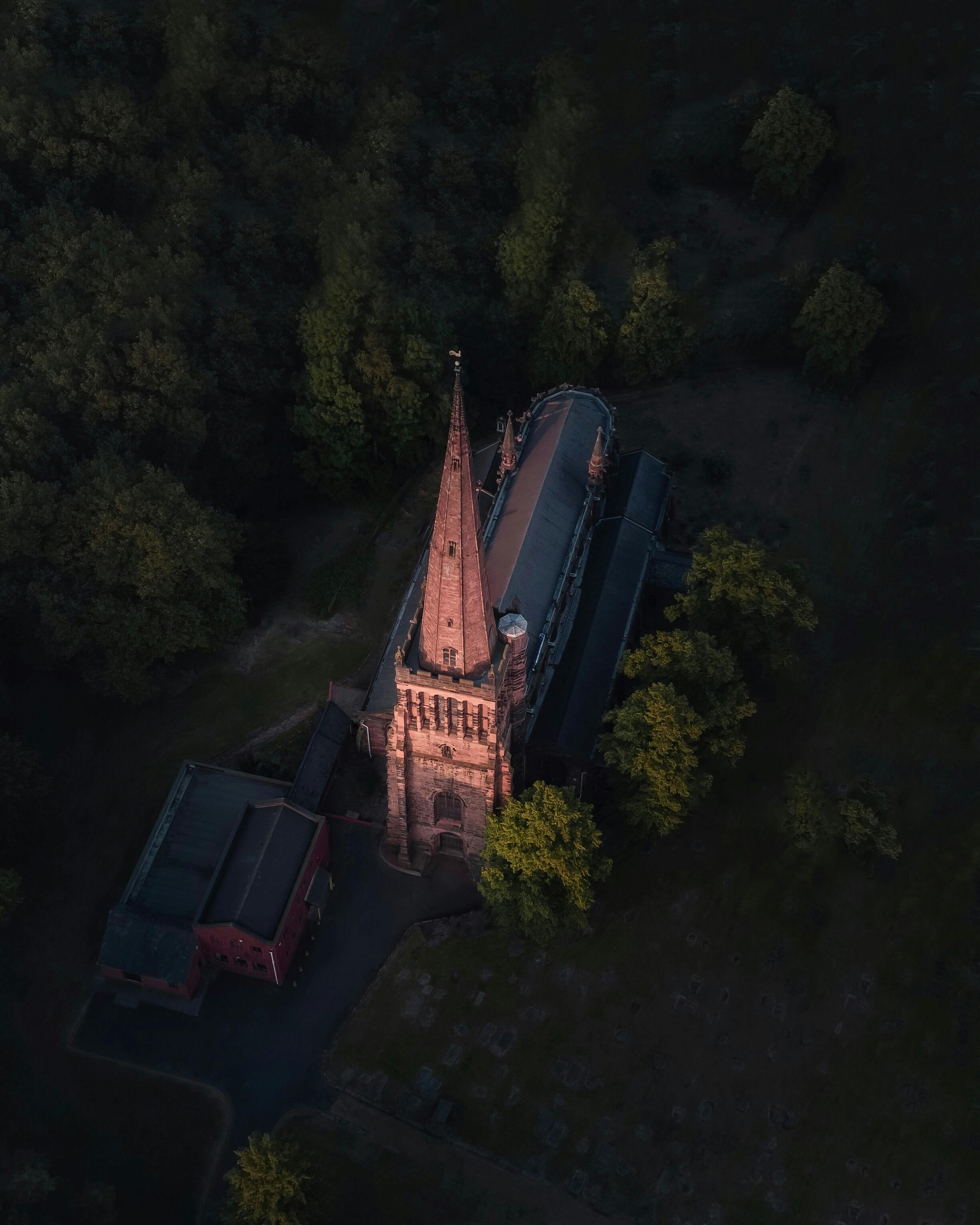 Aerial View of a Church by a Forest · Free Stock Photo