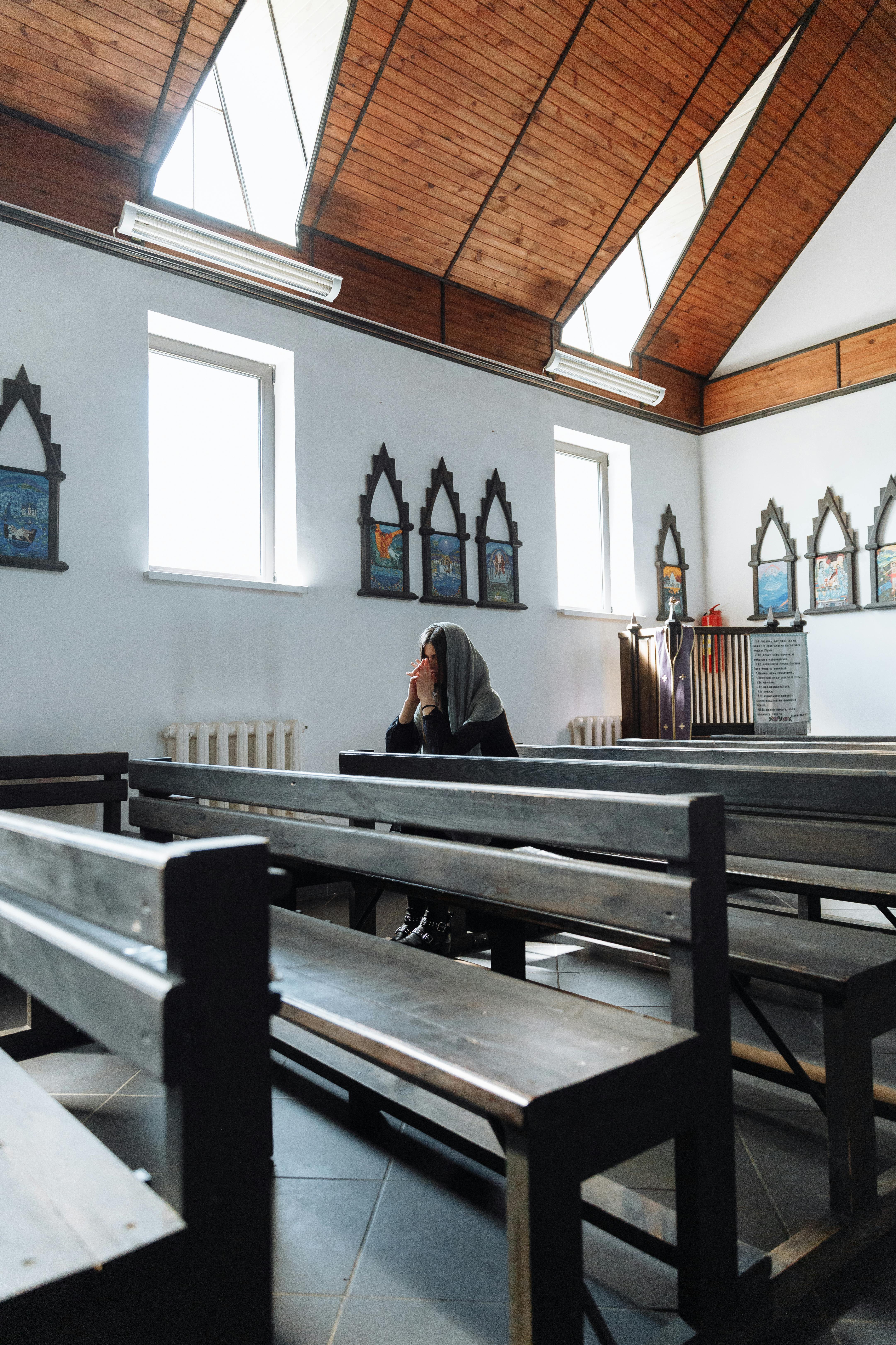 A Woman Praying in the Church · Free Stock Photo