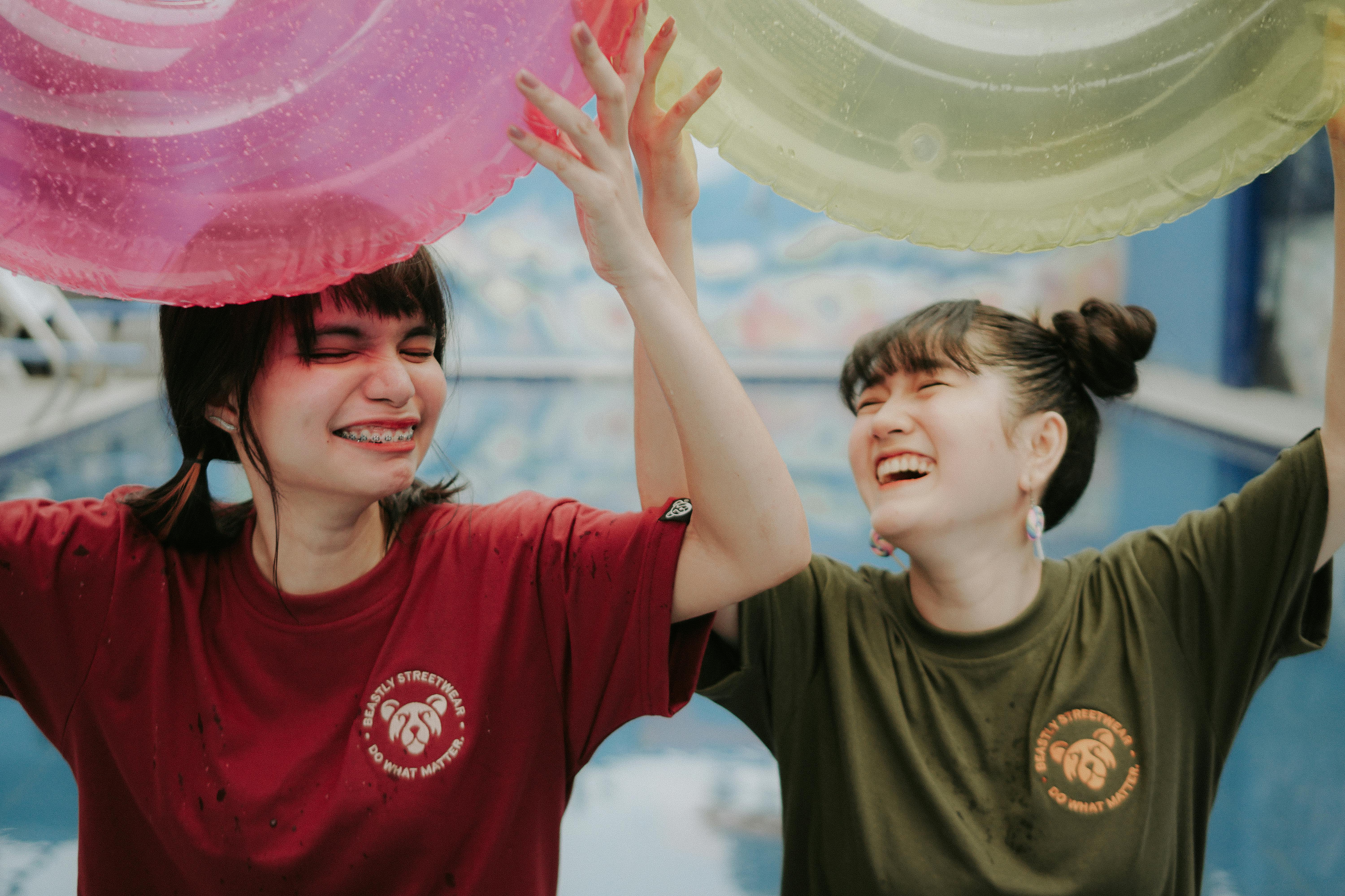 Women Holding Floaters · Free Stock Photo