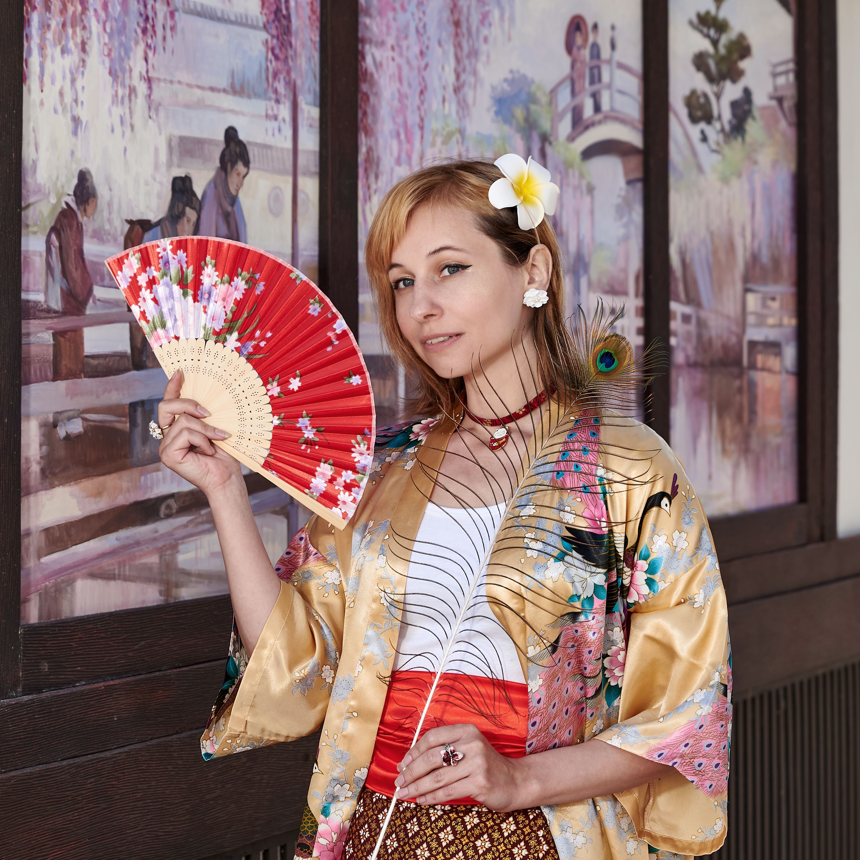 Close-Up Shot of a Girl in Kimono Holding a Hand Fan · Free Stock Photo