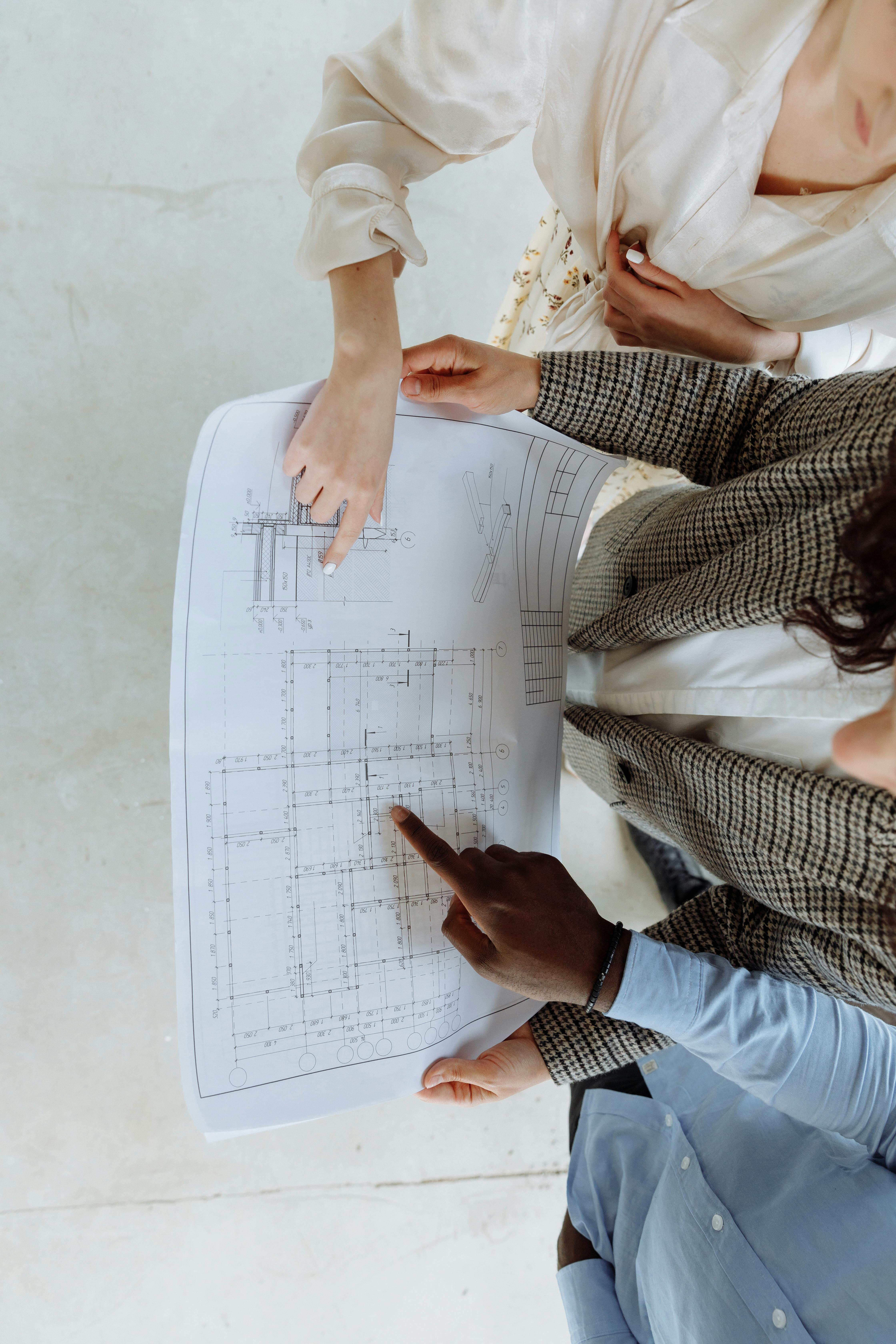 Couple Holding Blueprint of a House · Free Stock Photo