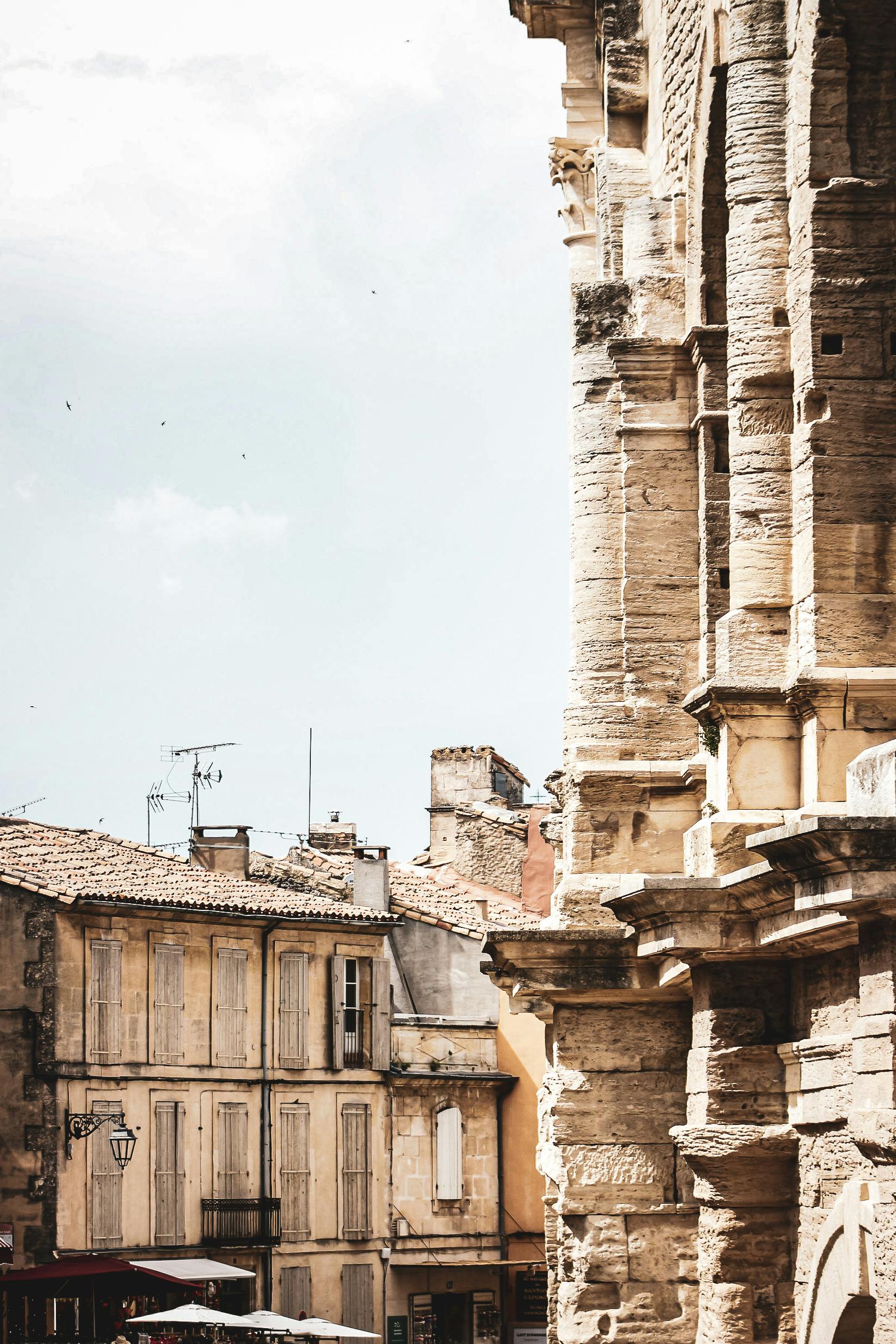 Old Concrete Building Near Concrete Houses Under Blue Sky · Free Stock ...