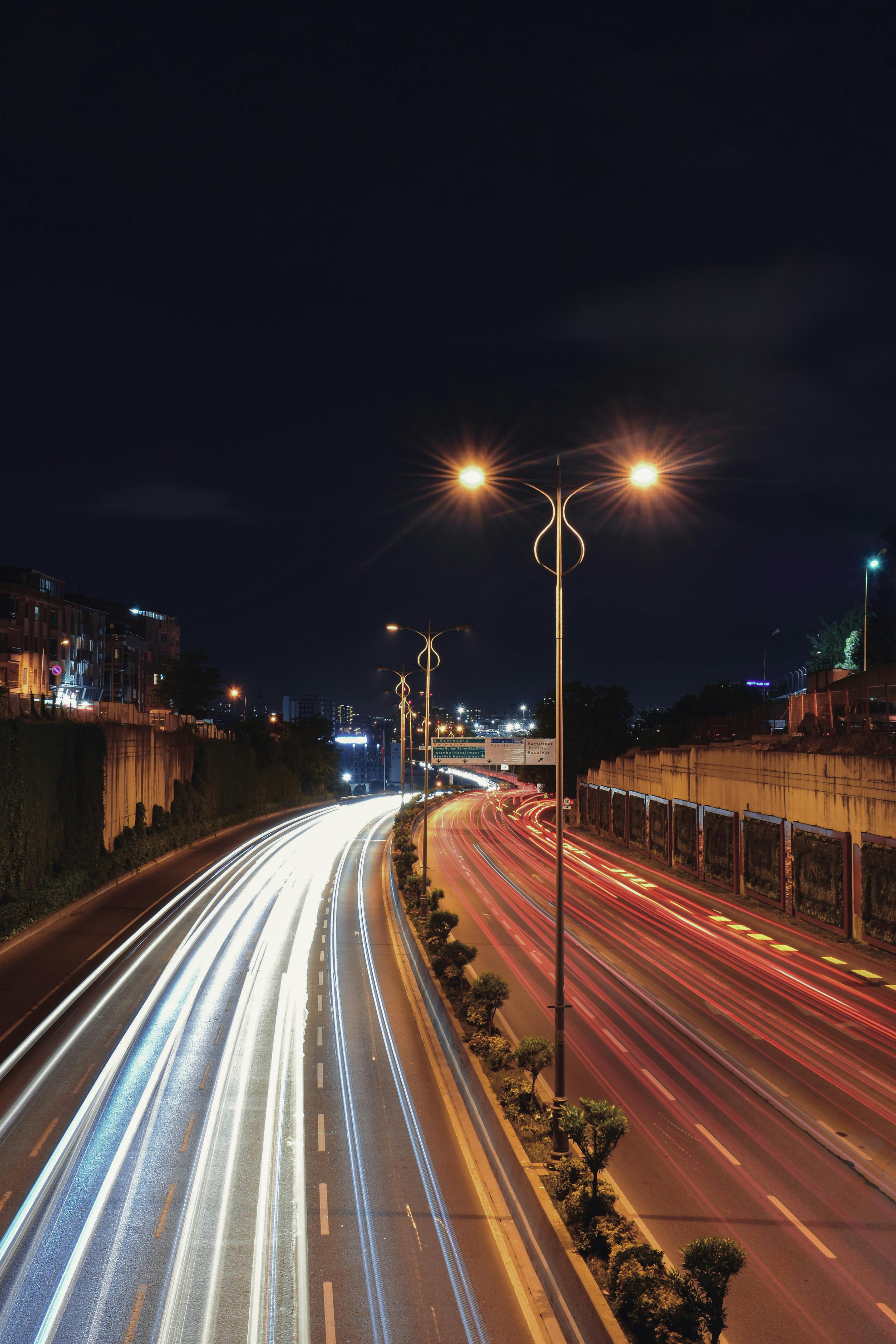 A Time-Lapse Photography of a Road at Night · Free Stock Photo