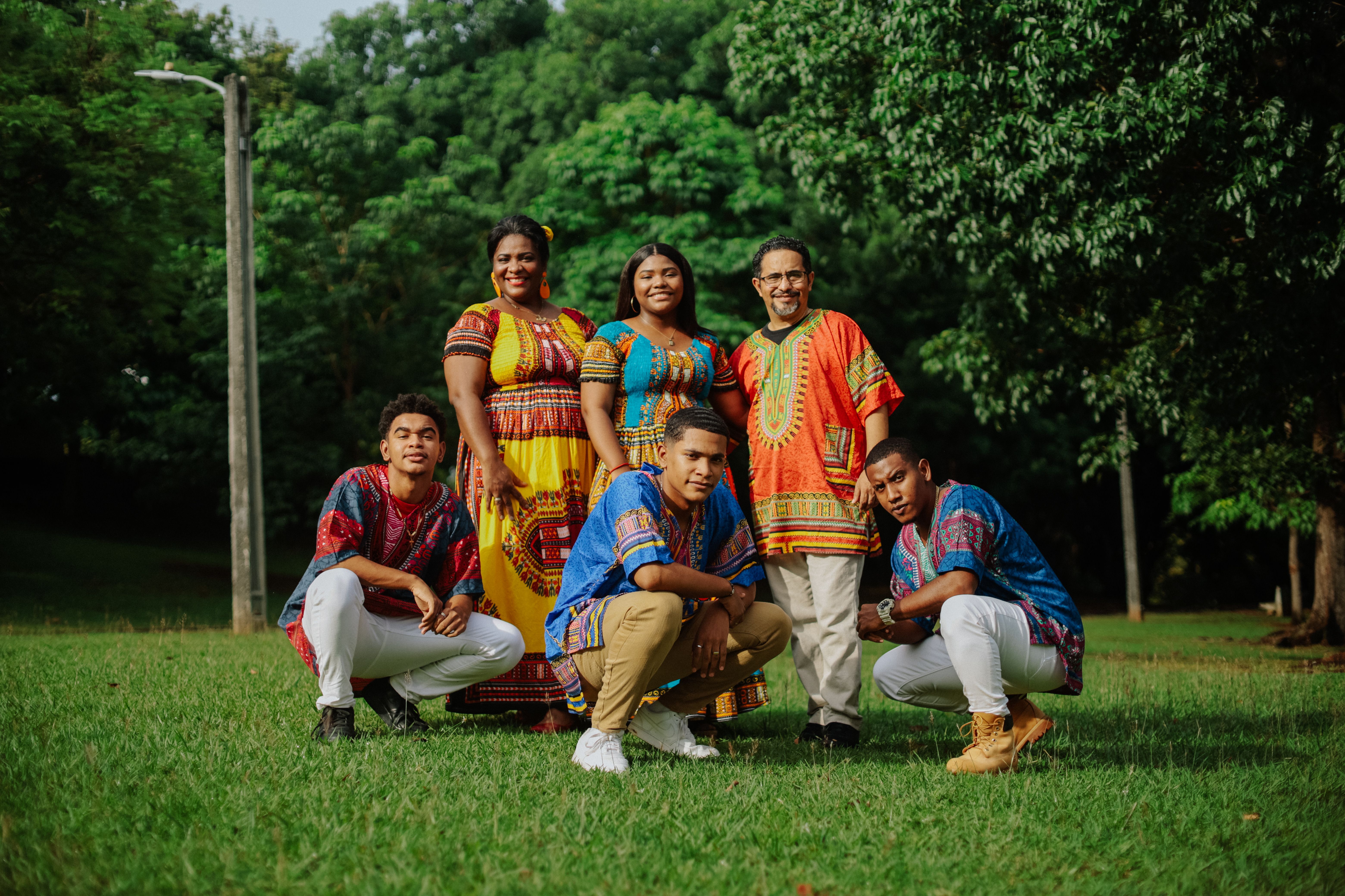 Family Wearing Traditional Clothing in Park · Free Stock Photo