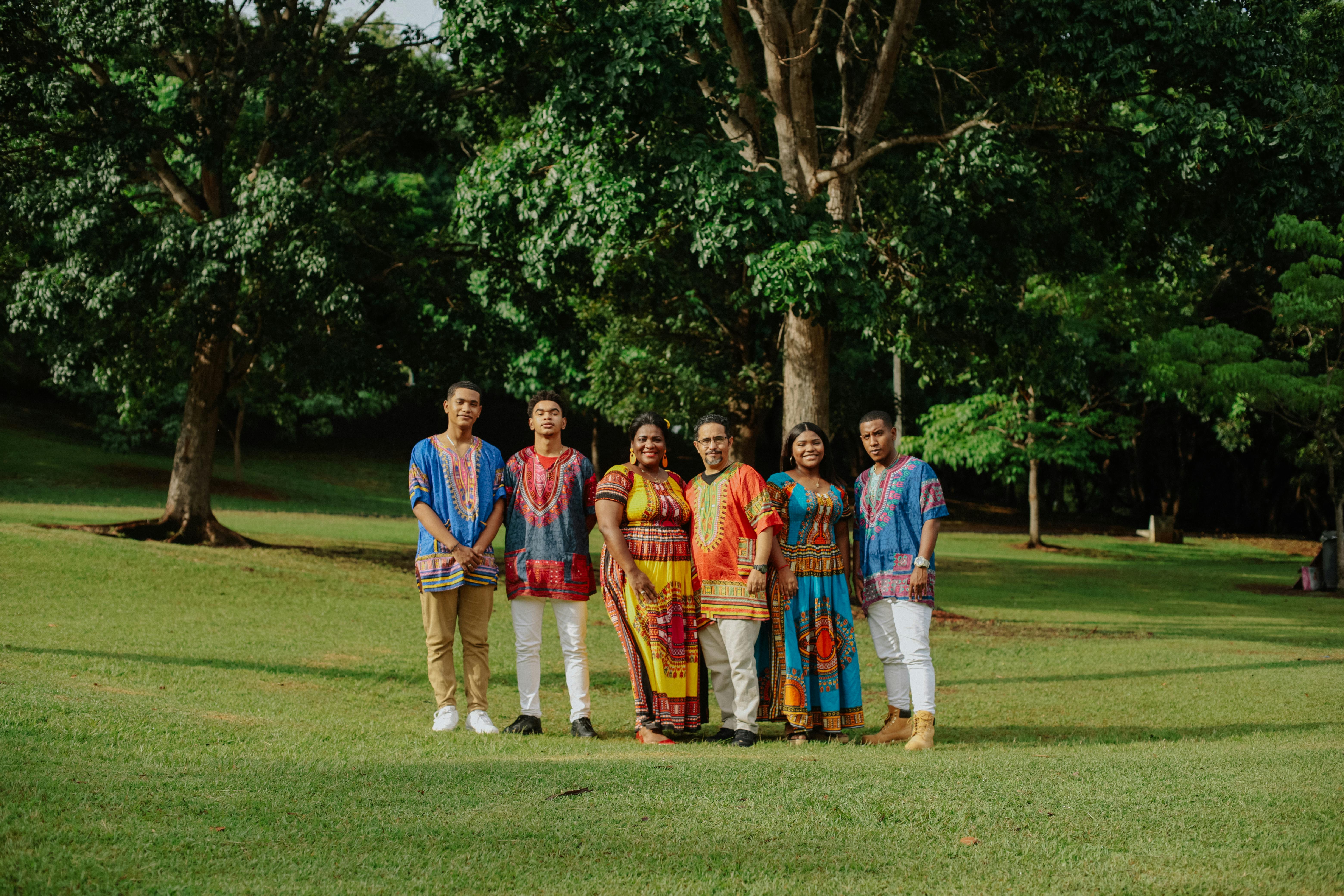 Group of People Standing on Green Grass Field · Free Stock Photo