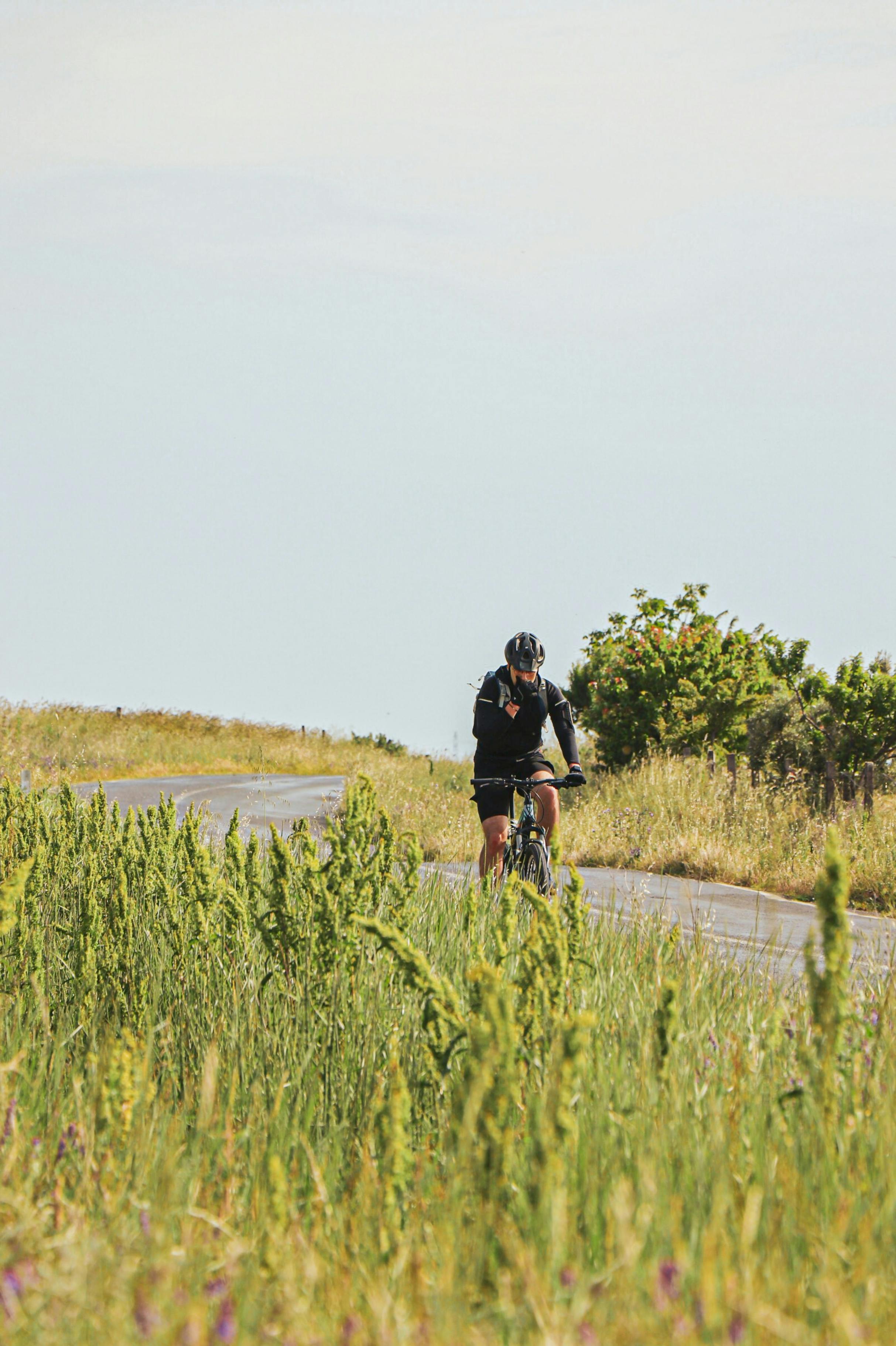 Man Riding a Mountain Bike on the Road · Free Stock Photo