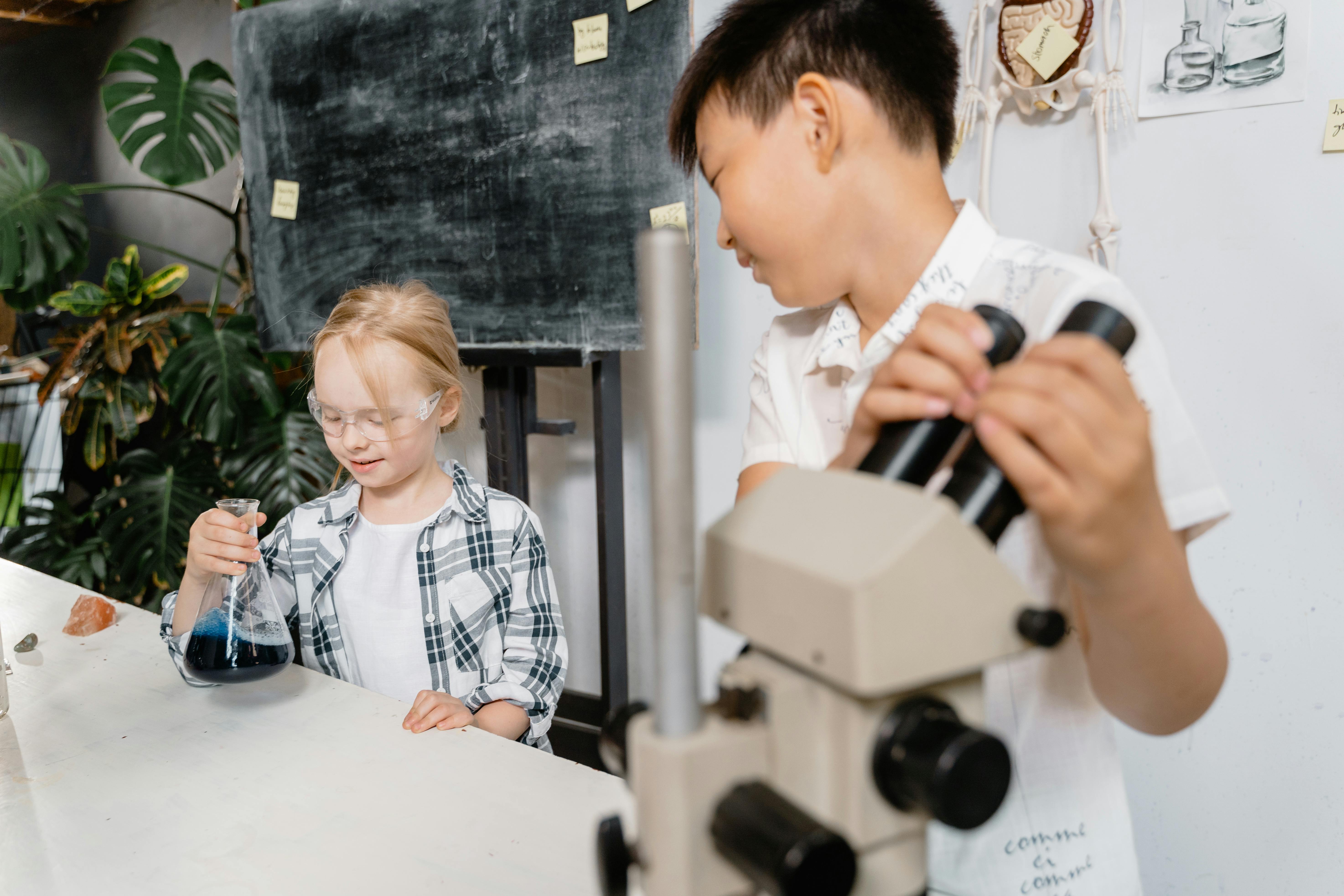 A Girl and a Boy in a Science Laboratory · Free Stock Photo
