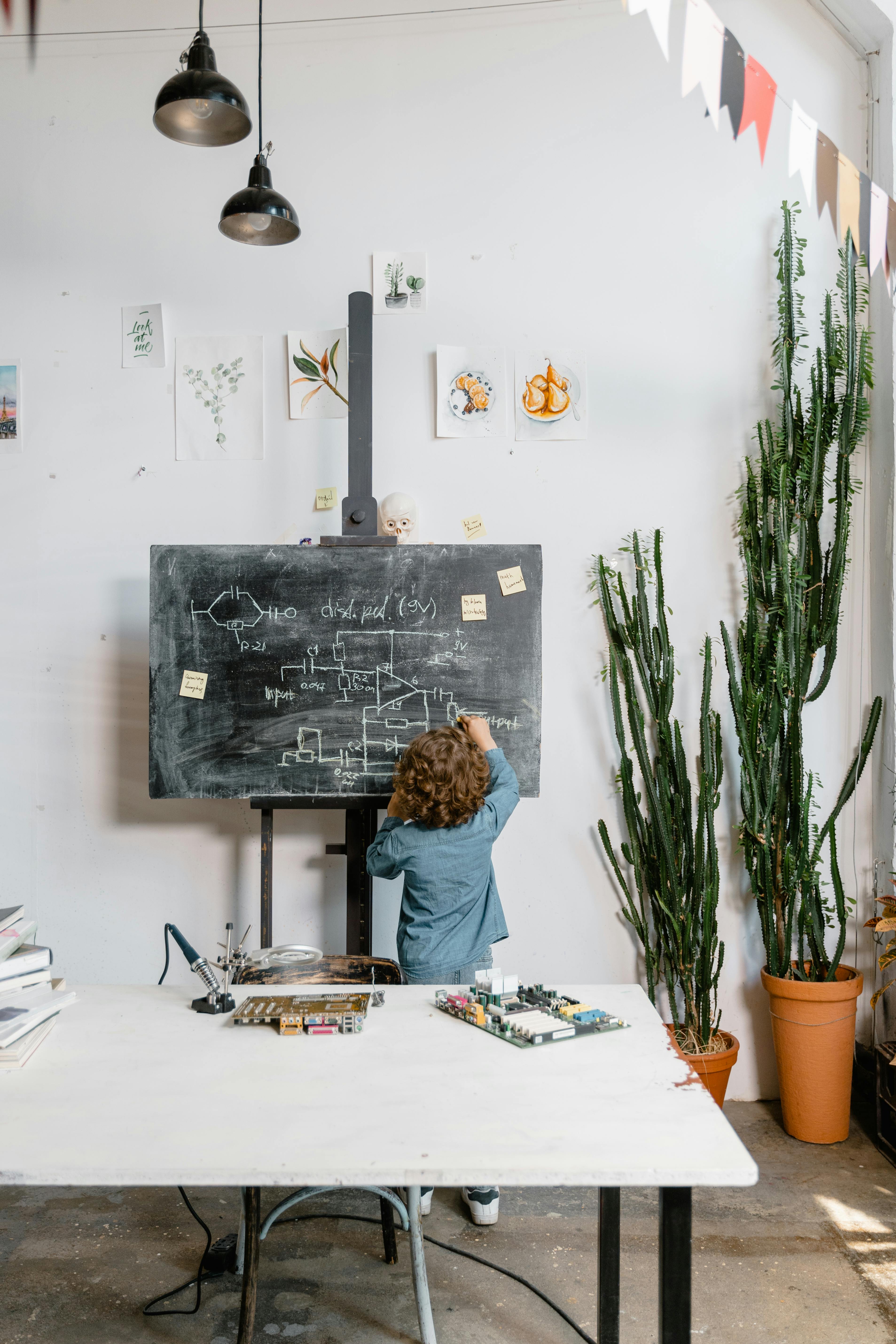 A Kid Writing on the Chalkboard · Free Stock Photo