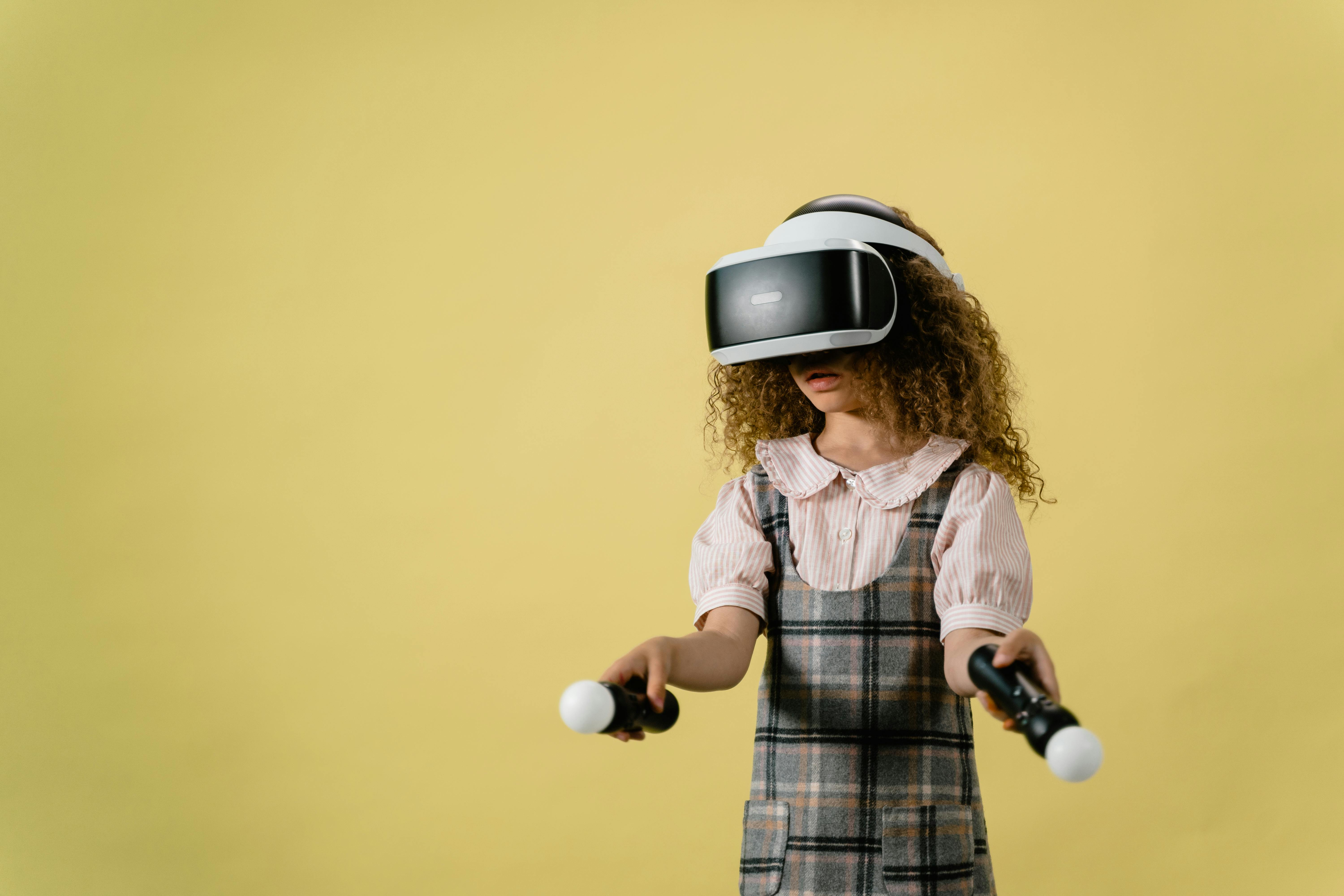 A Girl Using a VR Headset and Controllers · Free Stock Photo