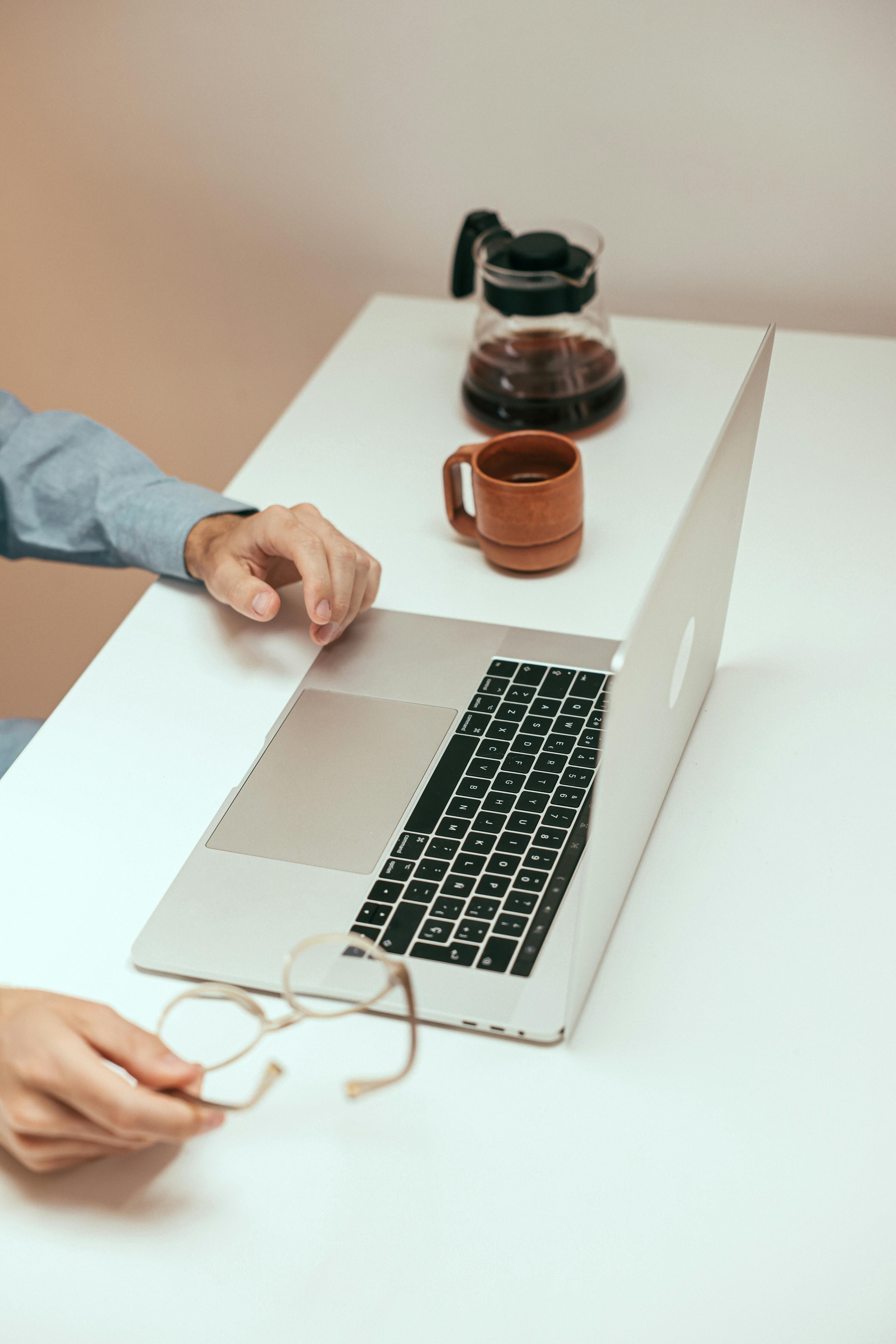 Man Using Silver Laptop Beside Another Man · Free Stock Photo