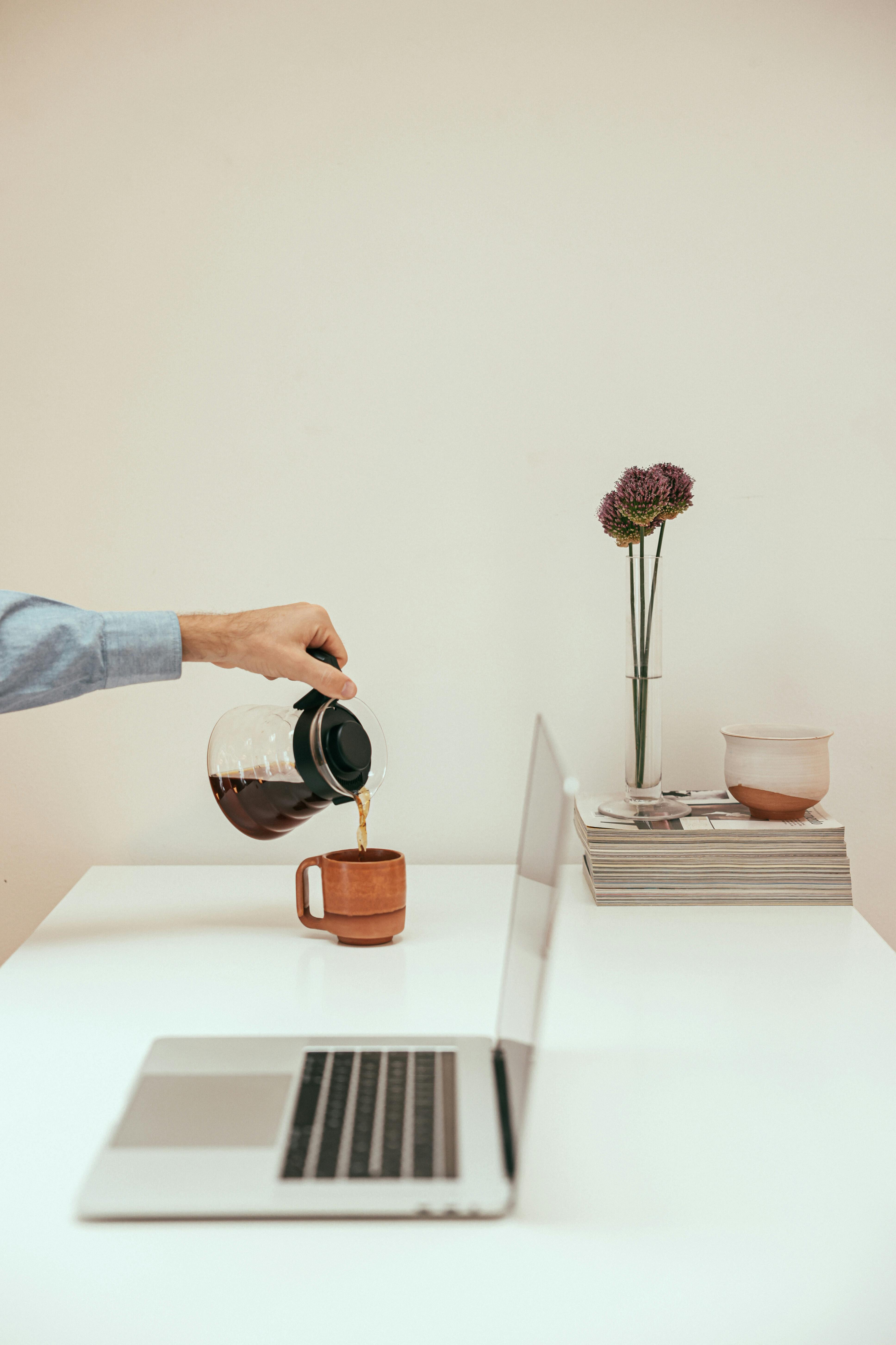 Modern Laptop and Coffee on Cafe Table · Free Stock Photo