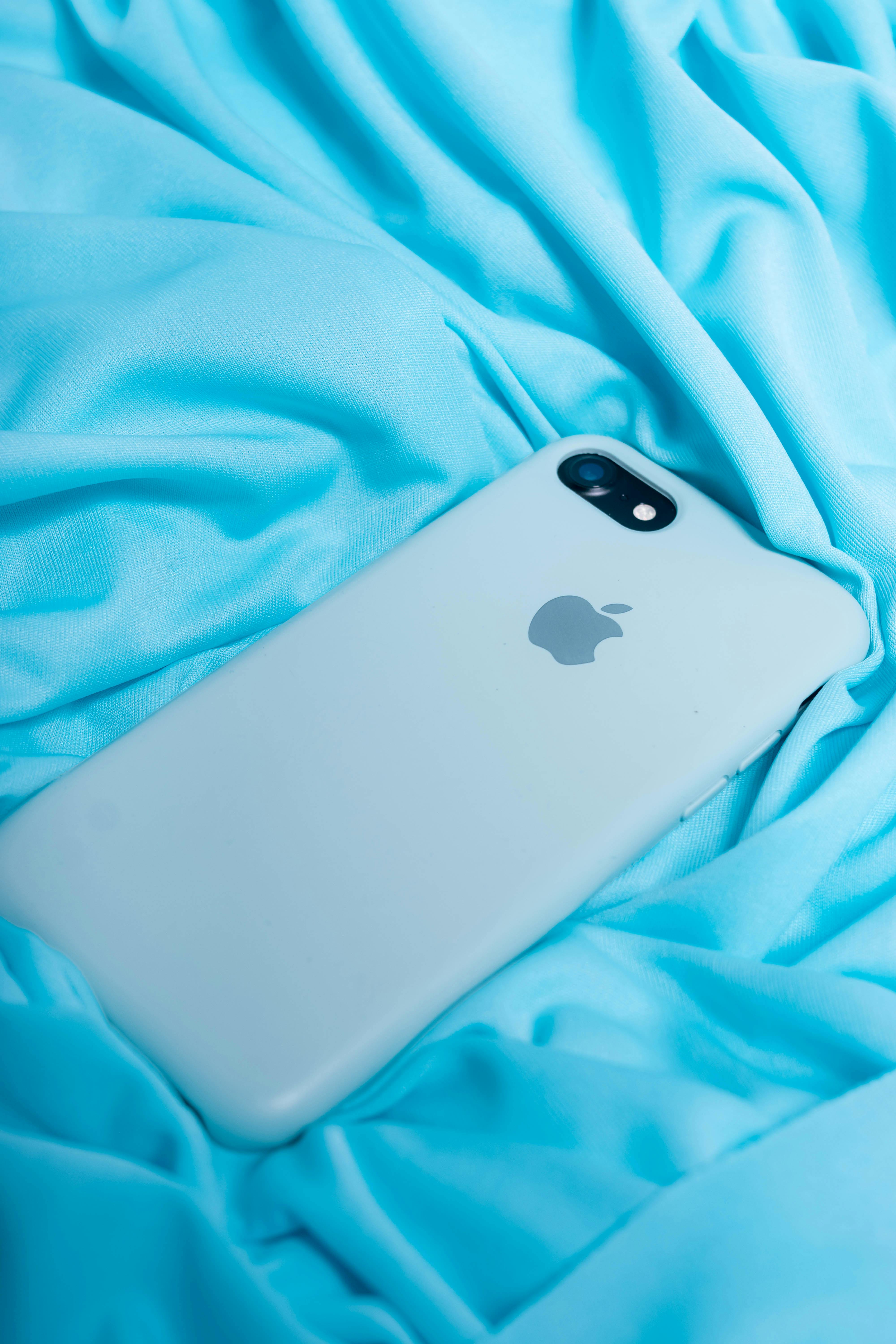 Modern smartphone in case on colorful cloth · Free Stock Photo