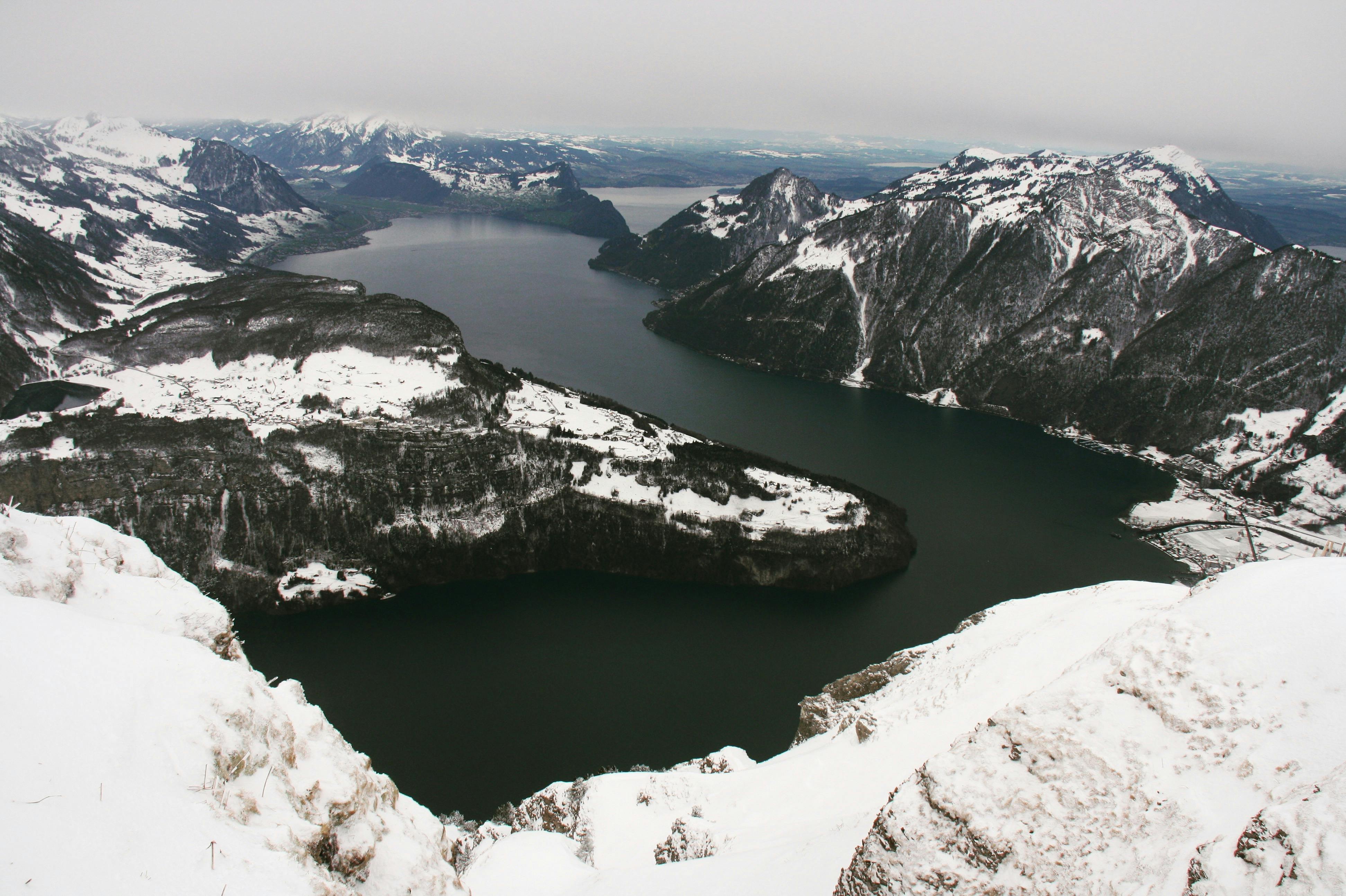 Islands With Snow Near Body of Water · Free Stock Photo