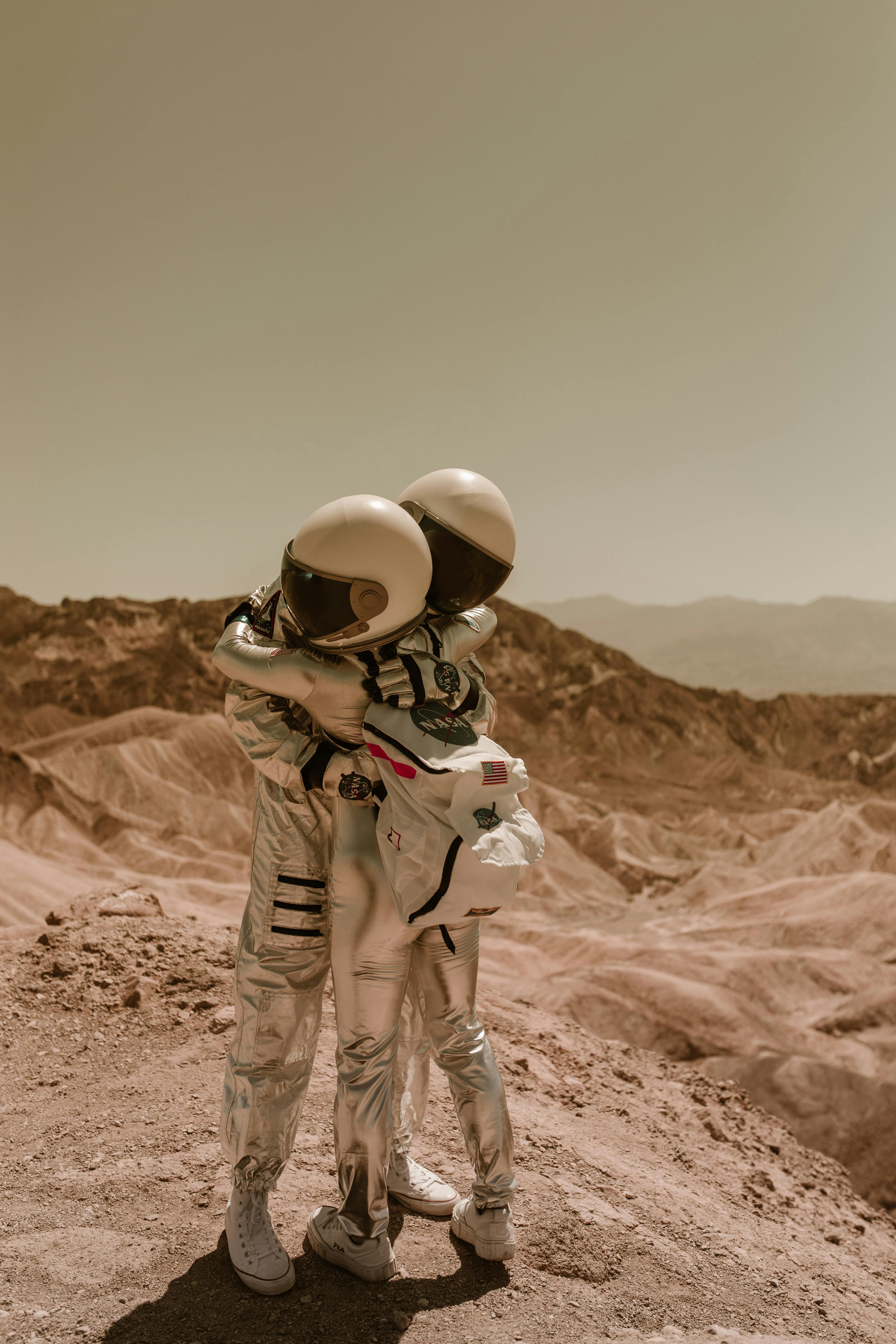 An Astronaut Couple Kissing Each Other · Free Stock Photo