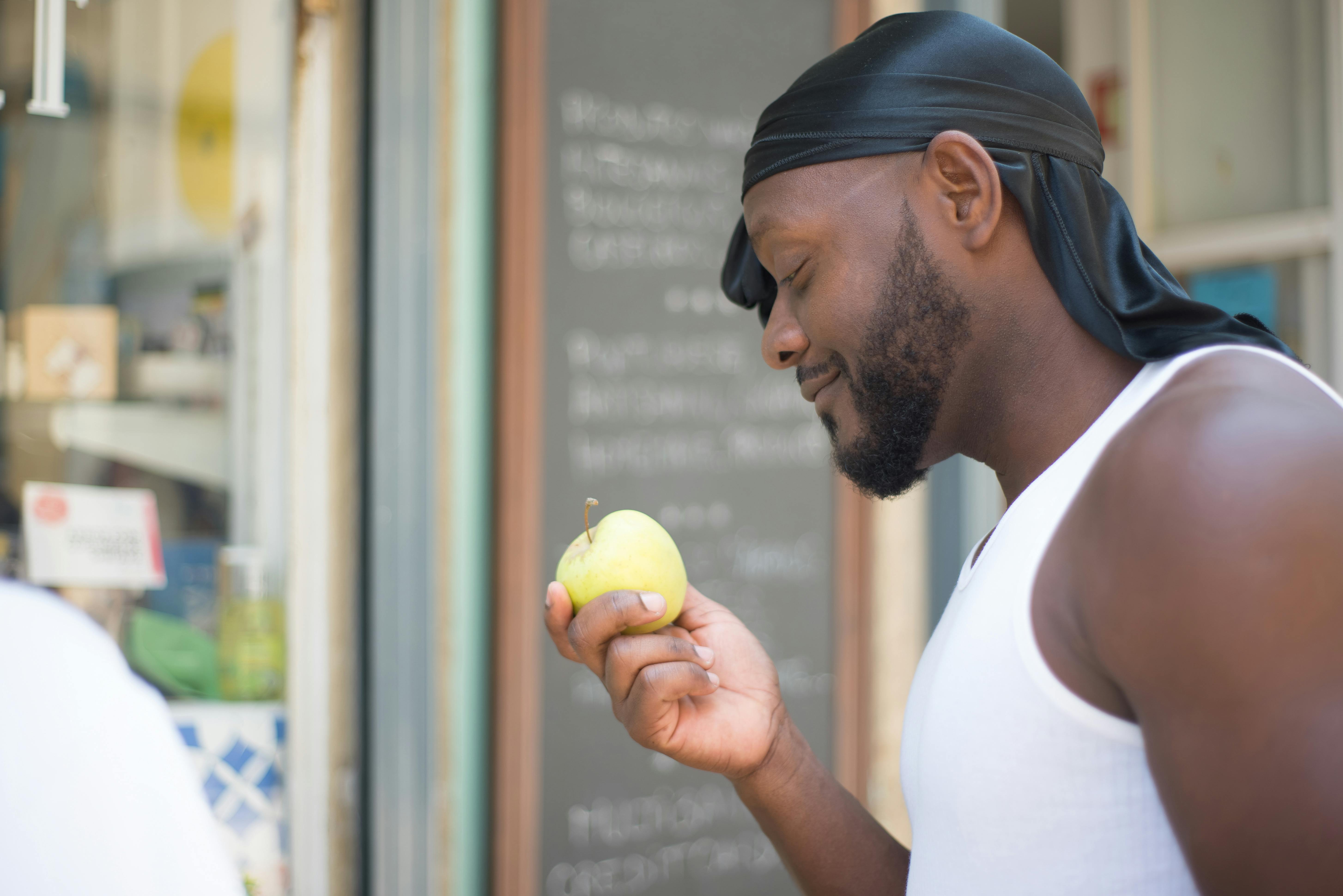 Man Selling Fruits in a Grocery · Free Stock Photo