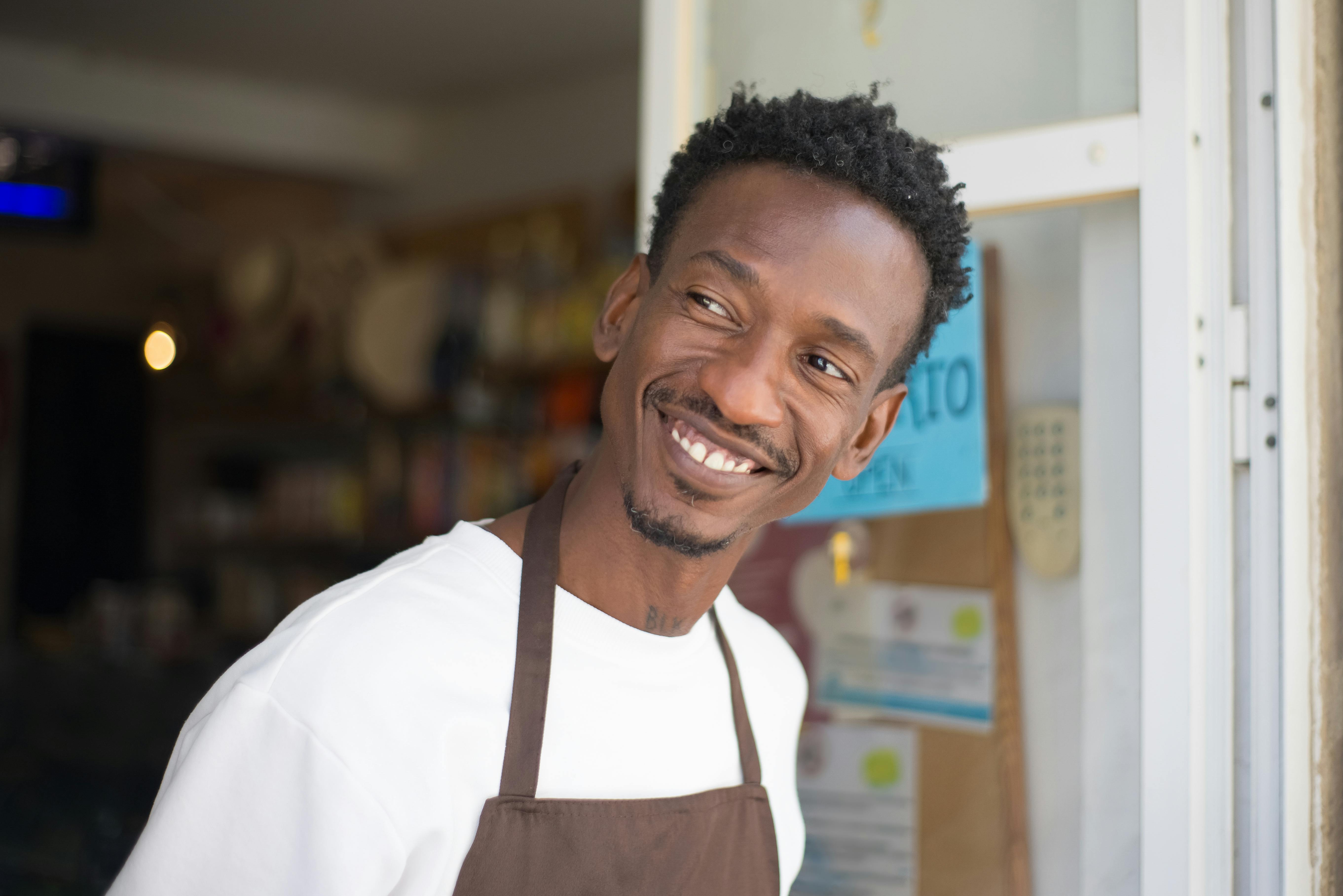 Man Selling Fruits in a Grocery · Free Stock Photo
