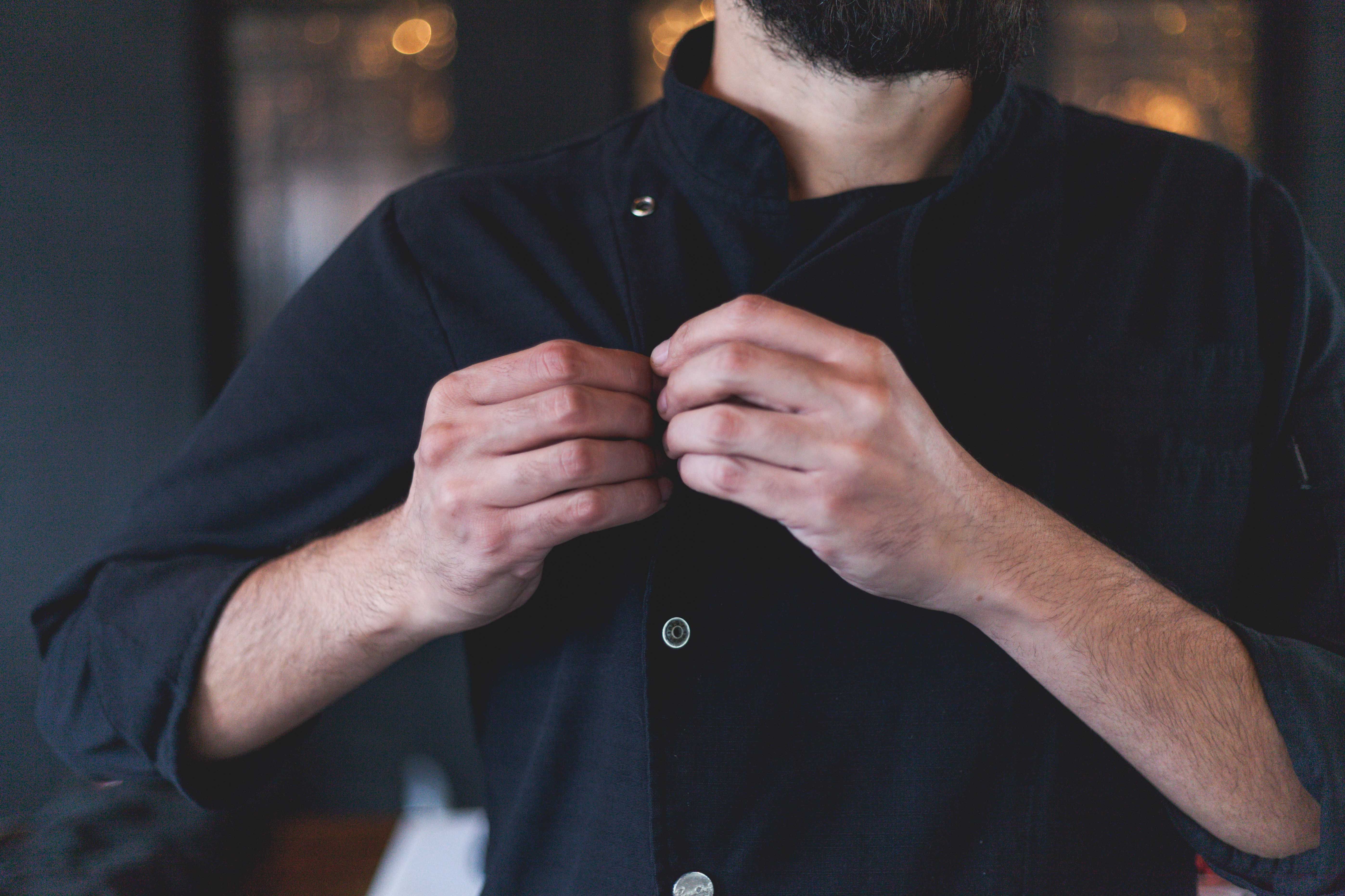 Close-Up Shot of a Hand Pressing an Elevator Button · Free Stock Photo