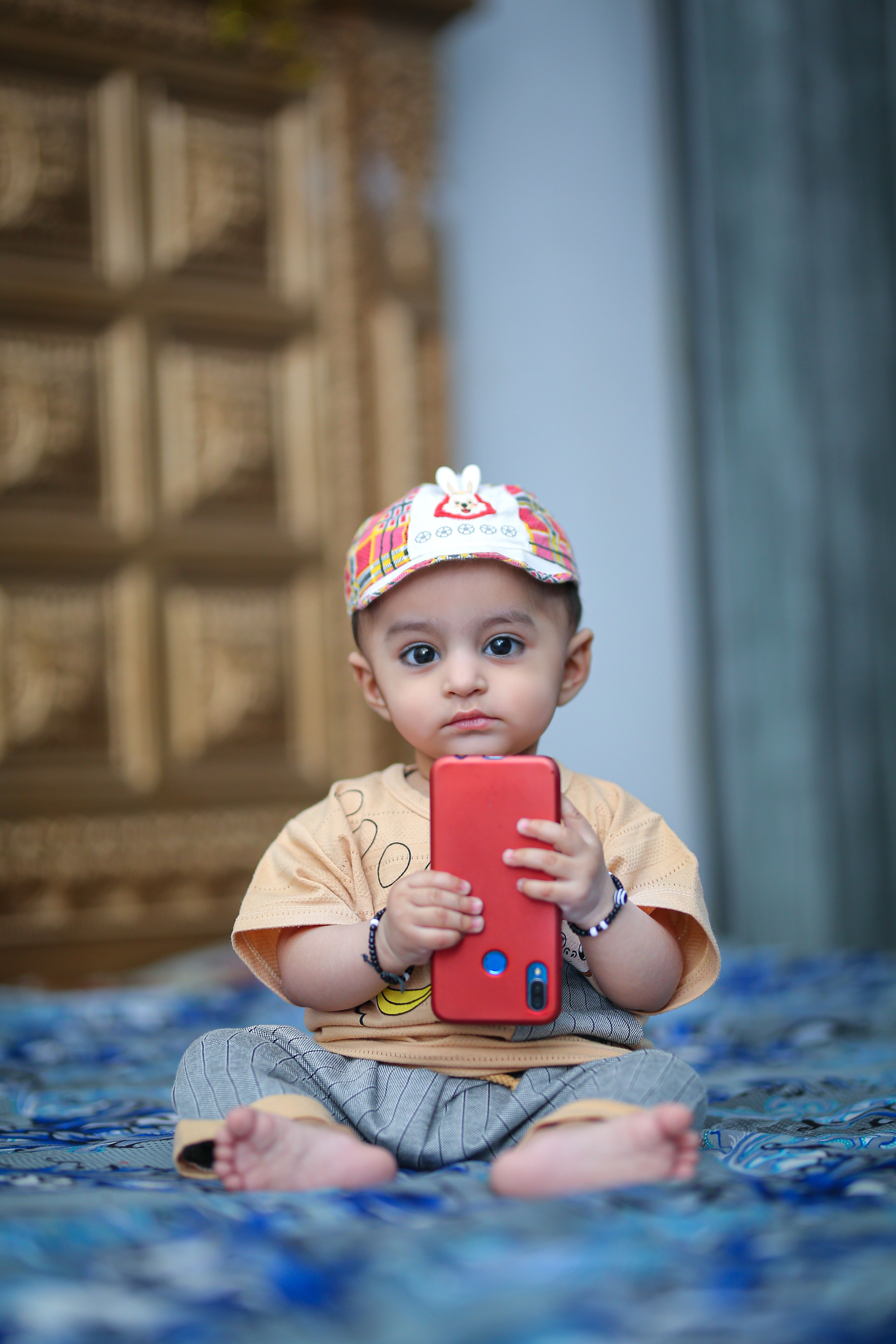 Baby Holding a Phone · Free Stock Photo