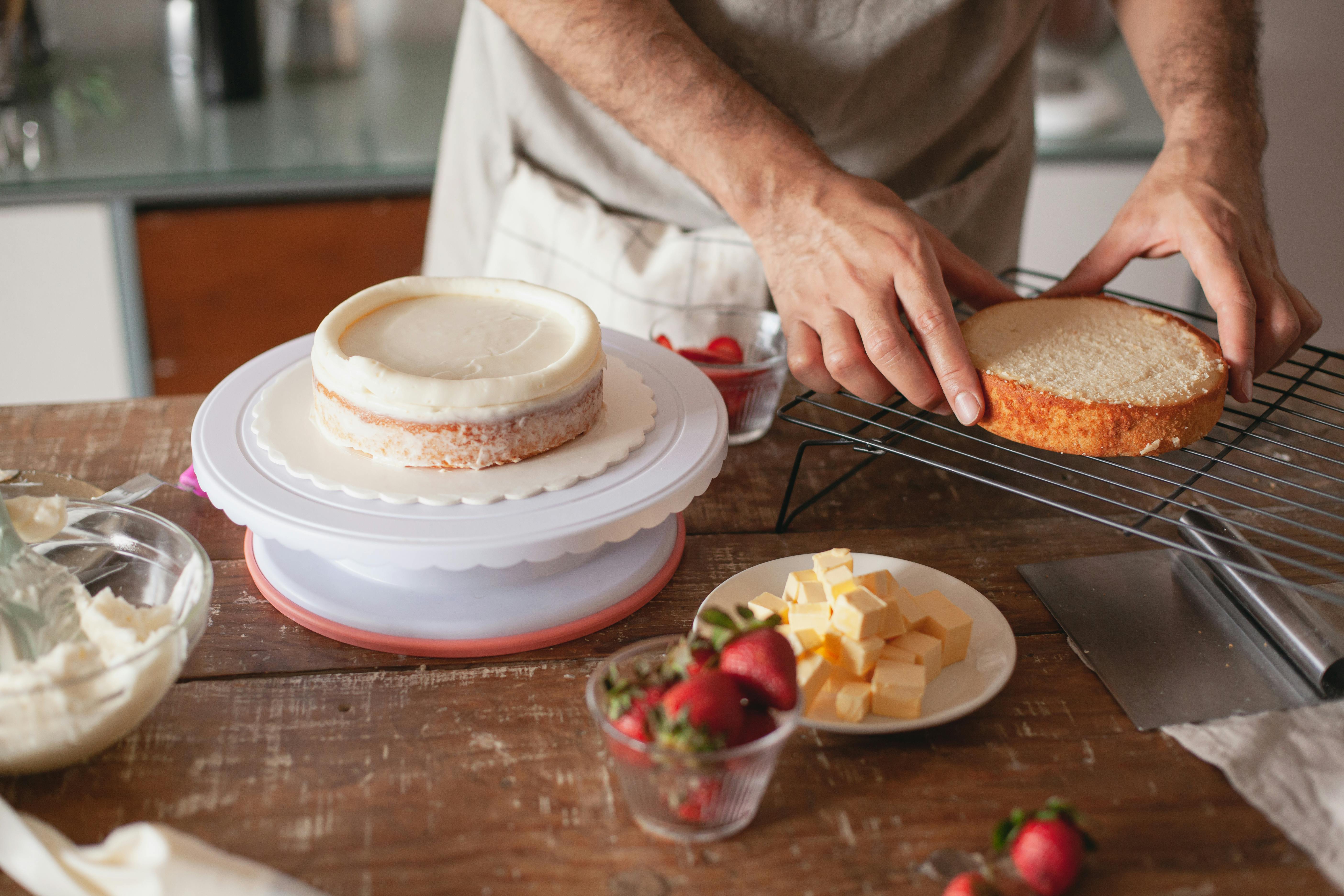 Person Putting an Icing on Top of a Cake Slice · Free Stock Photo